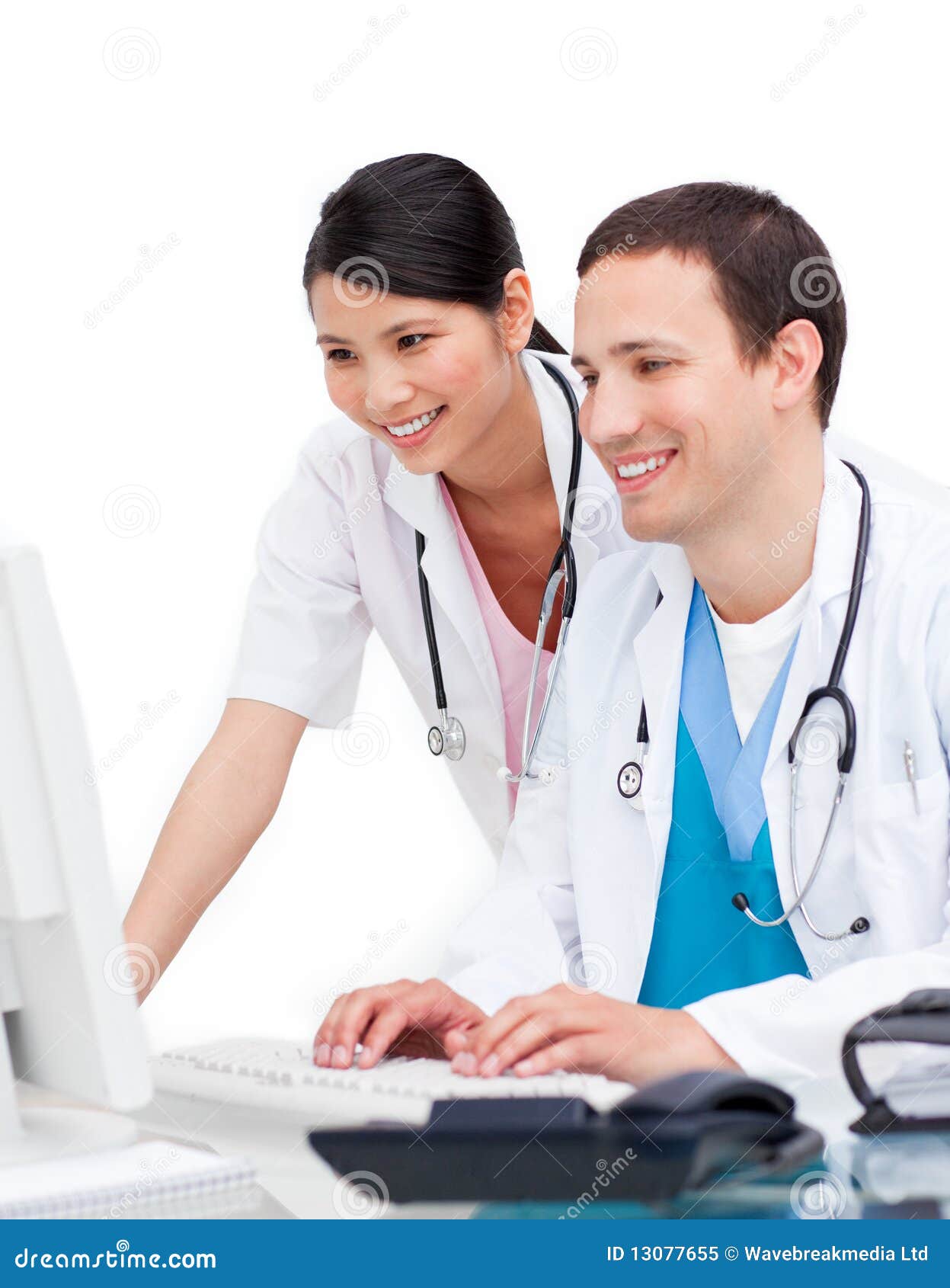 Two Happy Doctors Working at a Computer Stock Image - Image of team ...