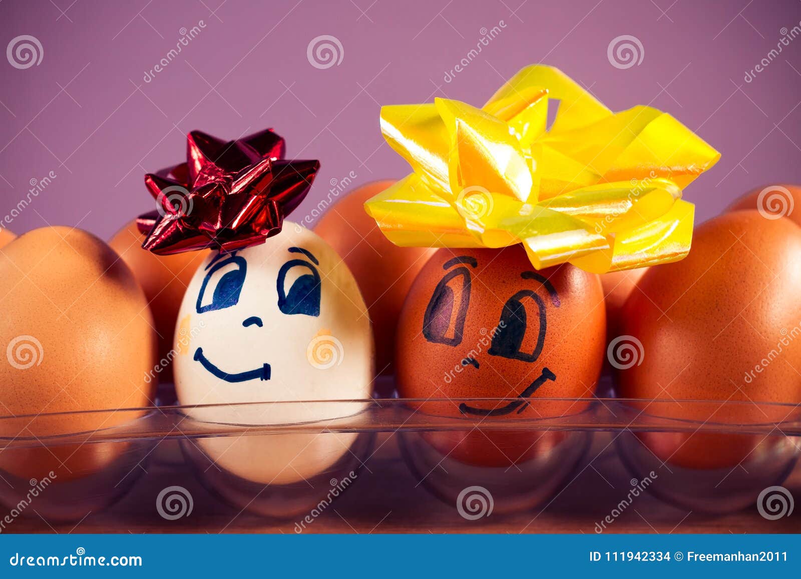 Two Happy Eggs in the Tray Look at Each Other.on Pink Background, Close ...