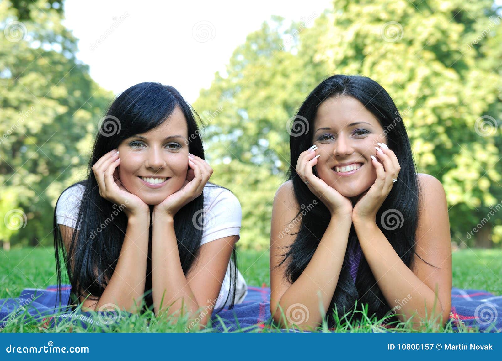 Two Happy Friends Lying Outdoors in Grass Stock Image - Image of ...
