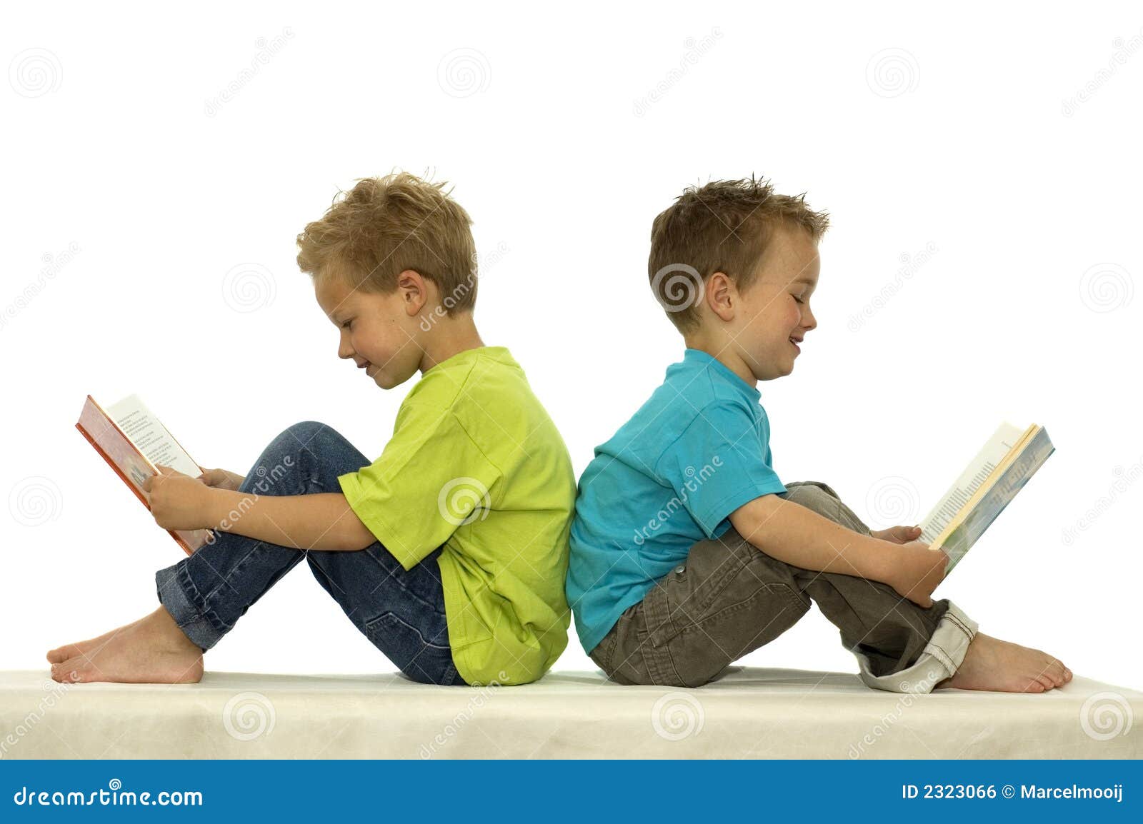 Two Friends Reading A Book In The Park, One Has A Broken Foot Royalty ...