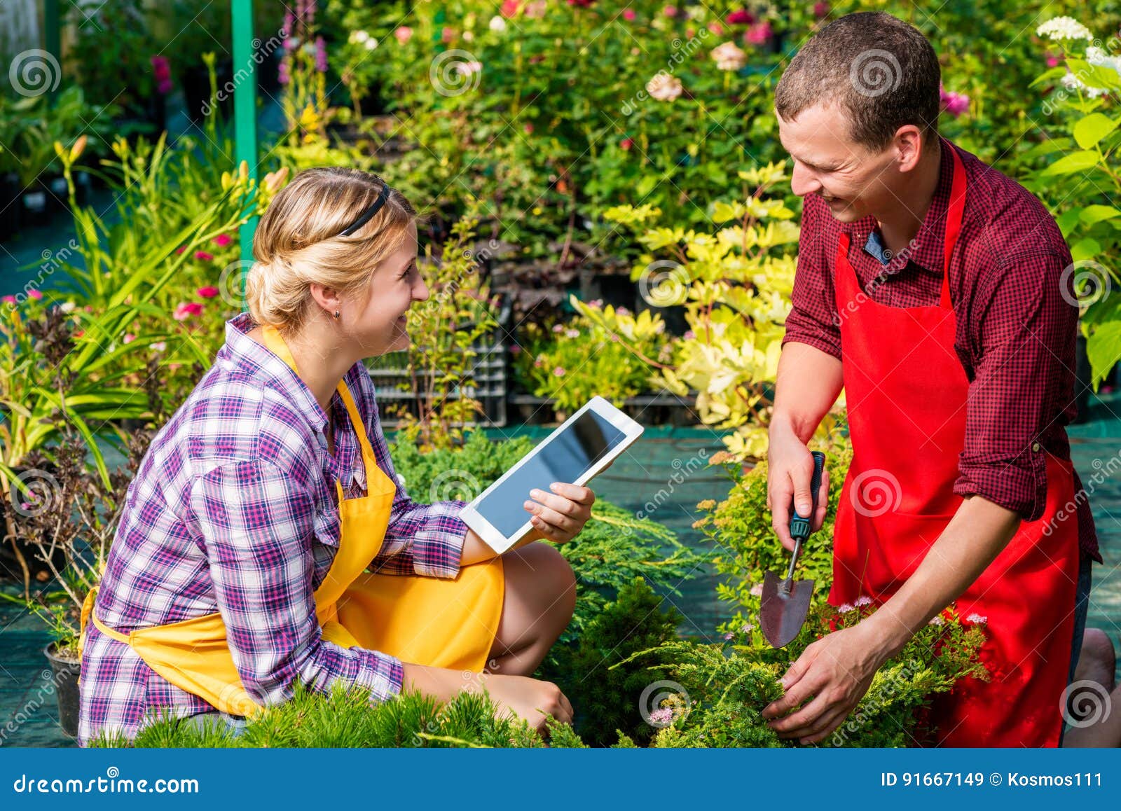 Two Happy Gardeners at Work Stock Image - Image of notepad, gardener ...