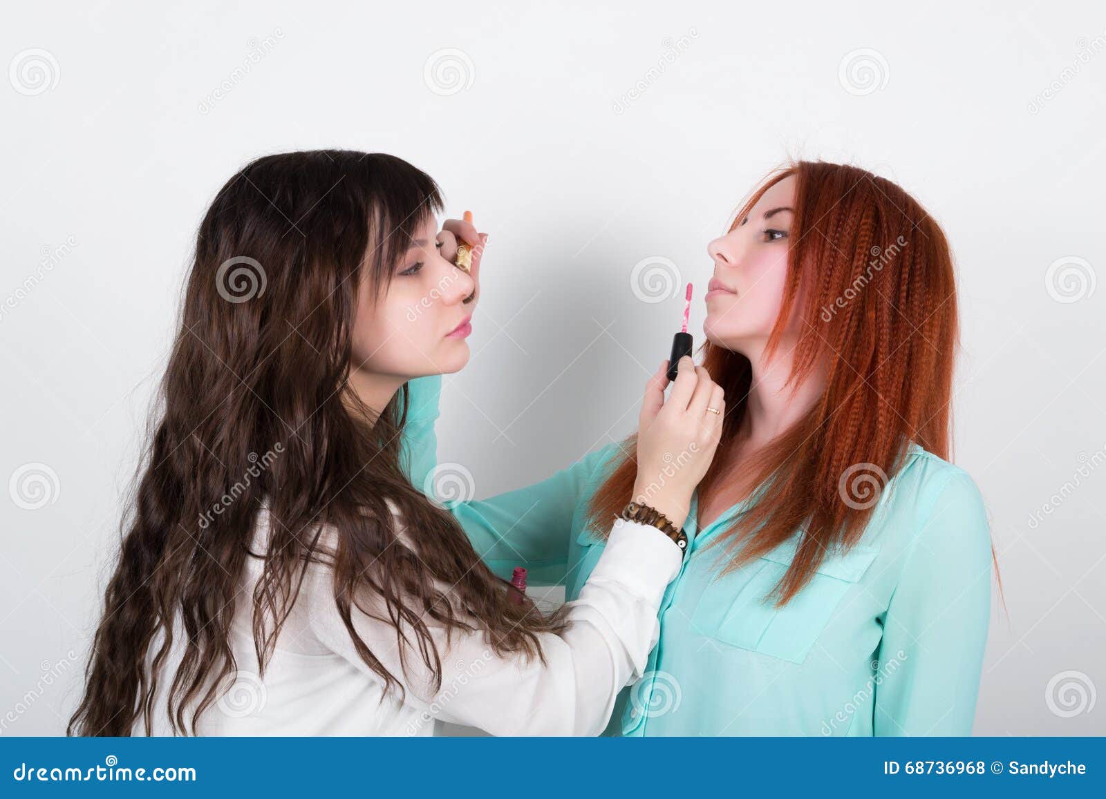 Two Happy Girlfriends Doing Makeup To Each Other Stock Photo - Image of ...