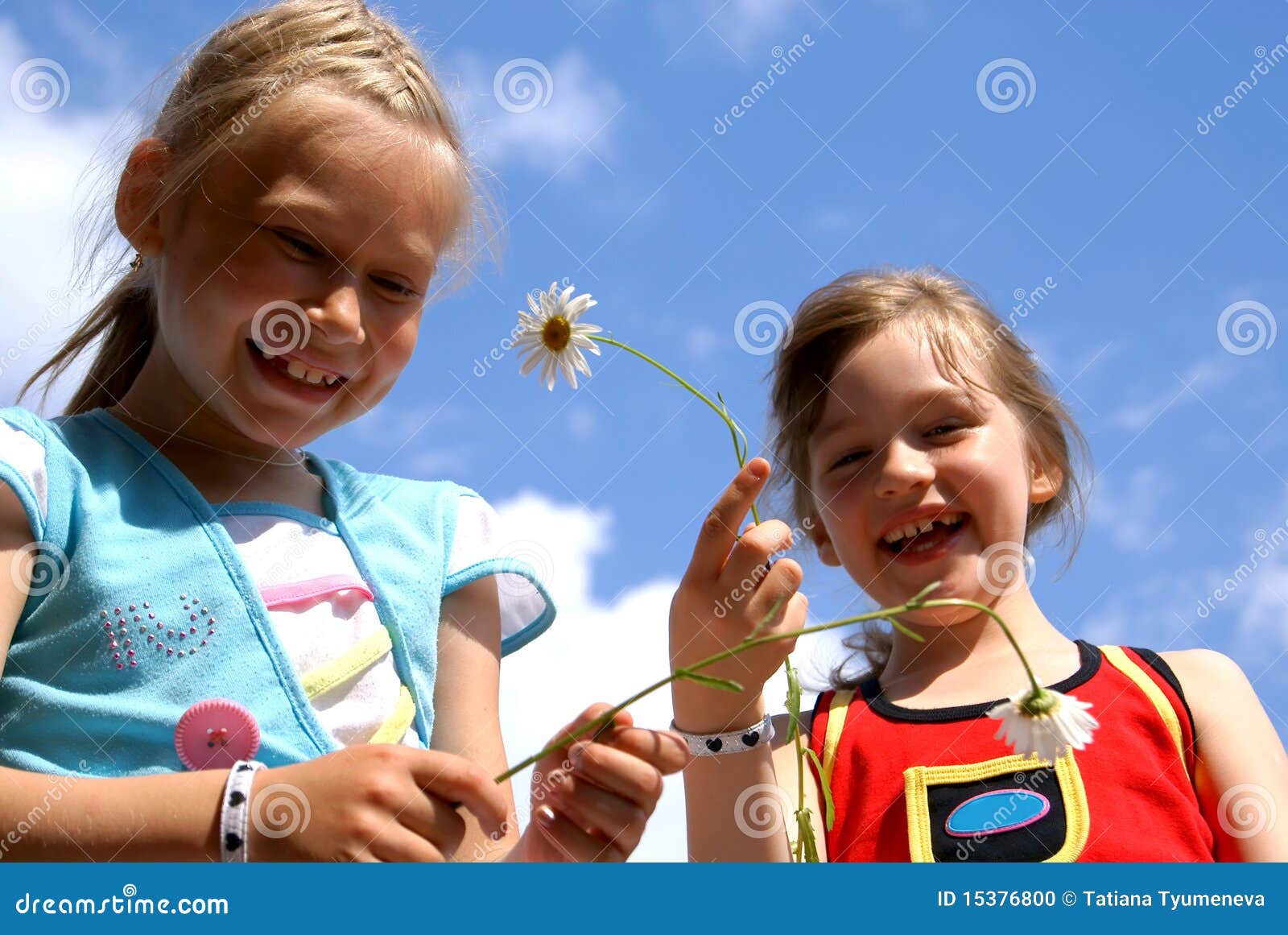 Two happy girls stock photo. Image of life, flowers, horisontal - 15376800