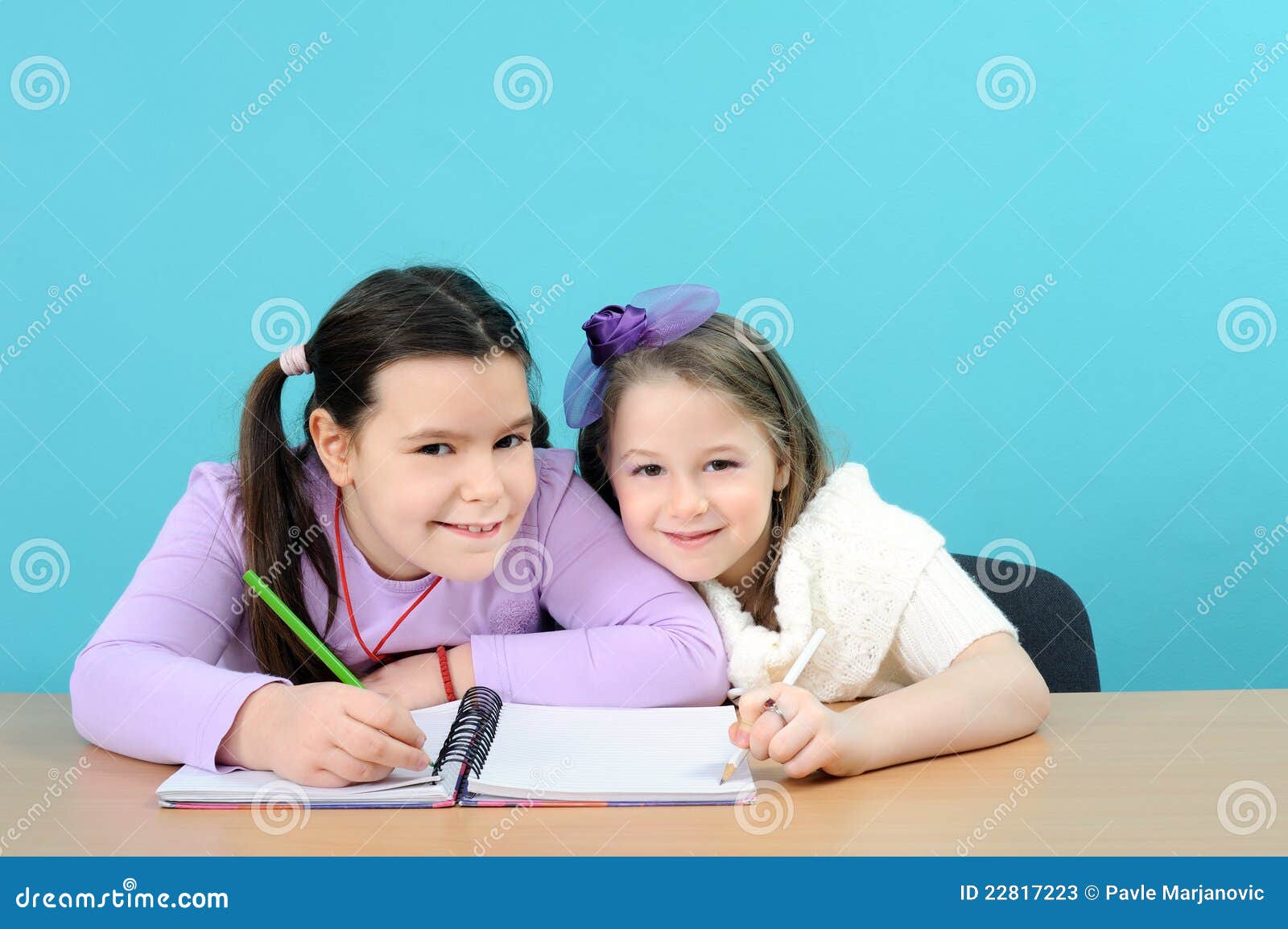 Two Happy Girls Doing Their School Work Stock Image - Image of color ...