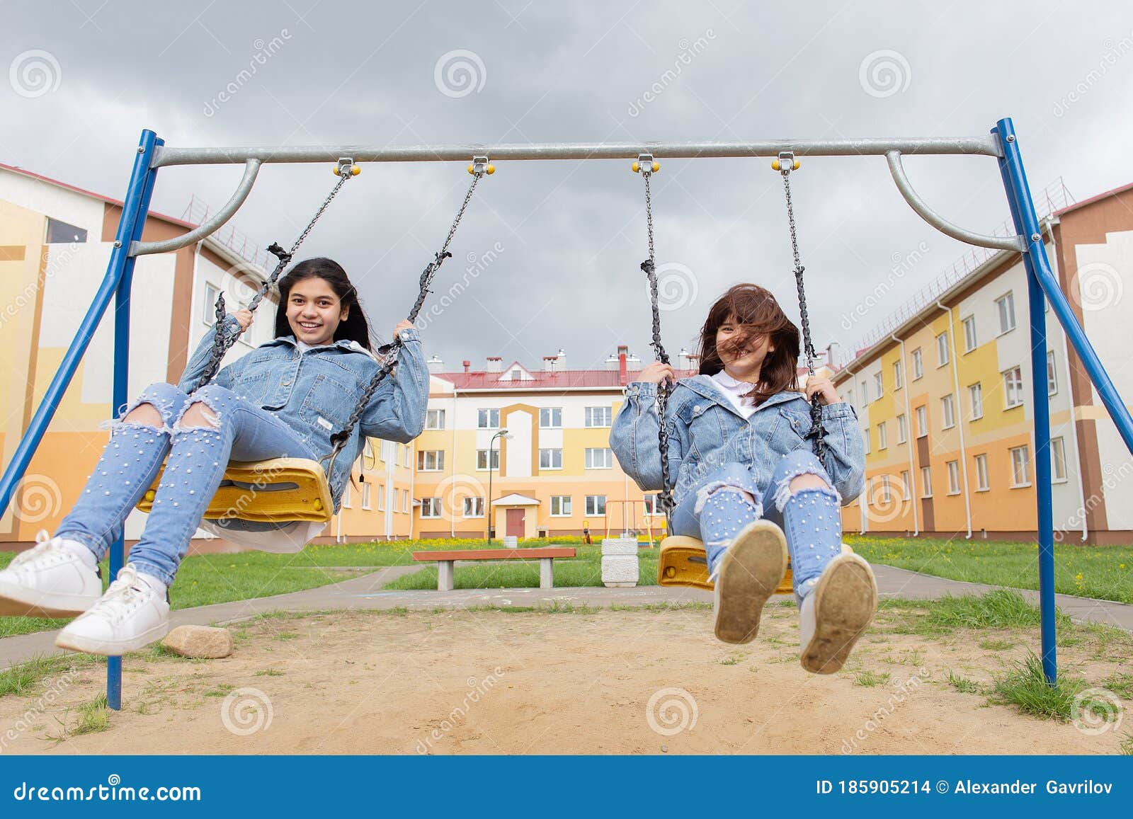 Two Happy Girls Ride a Swing Stock Photo - Image of excited, grass ...