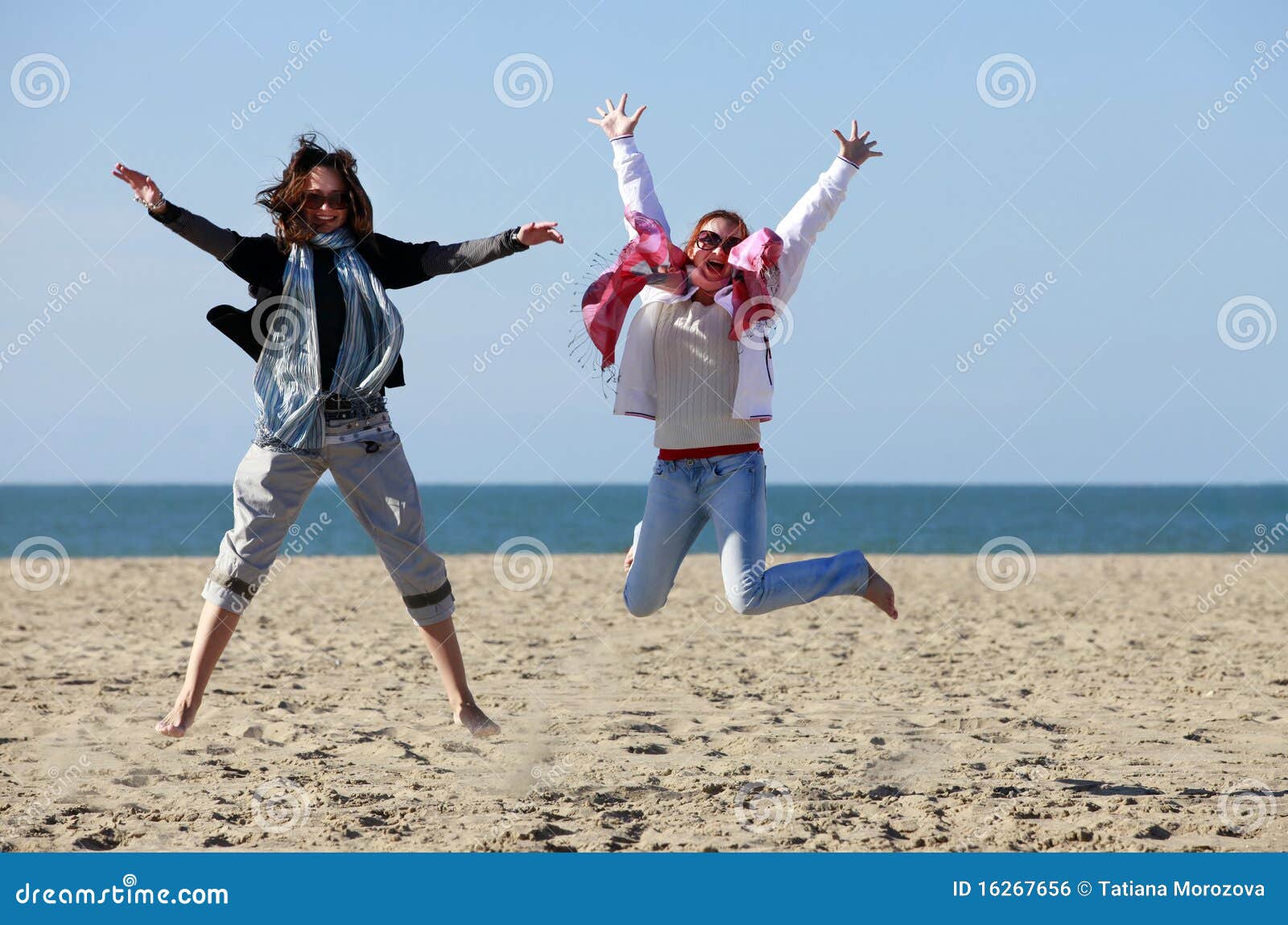 Two happy jumpers stock photo. Image of action, ocean - 16267656