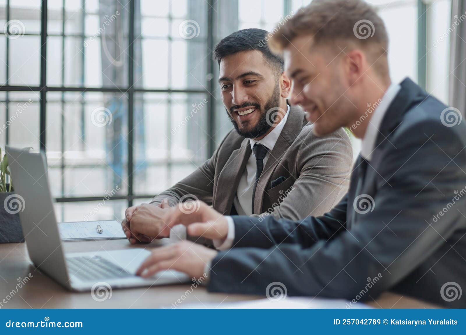 Two Happy Men Working Together on a New Business Project Stock Image ...
