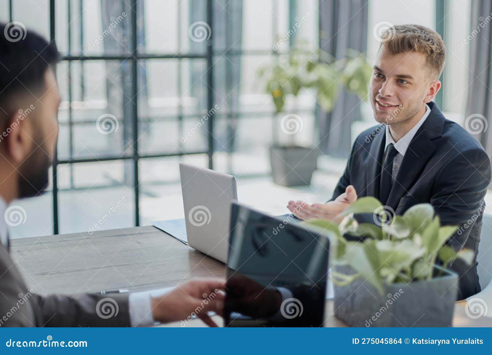 Two Happy Men Working Together on a New Business Project Stock Photo ...