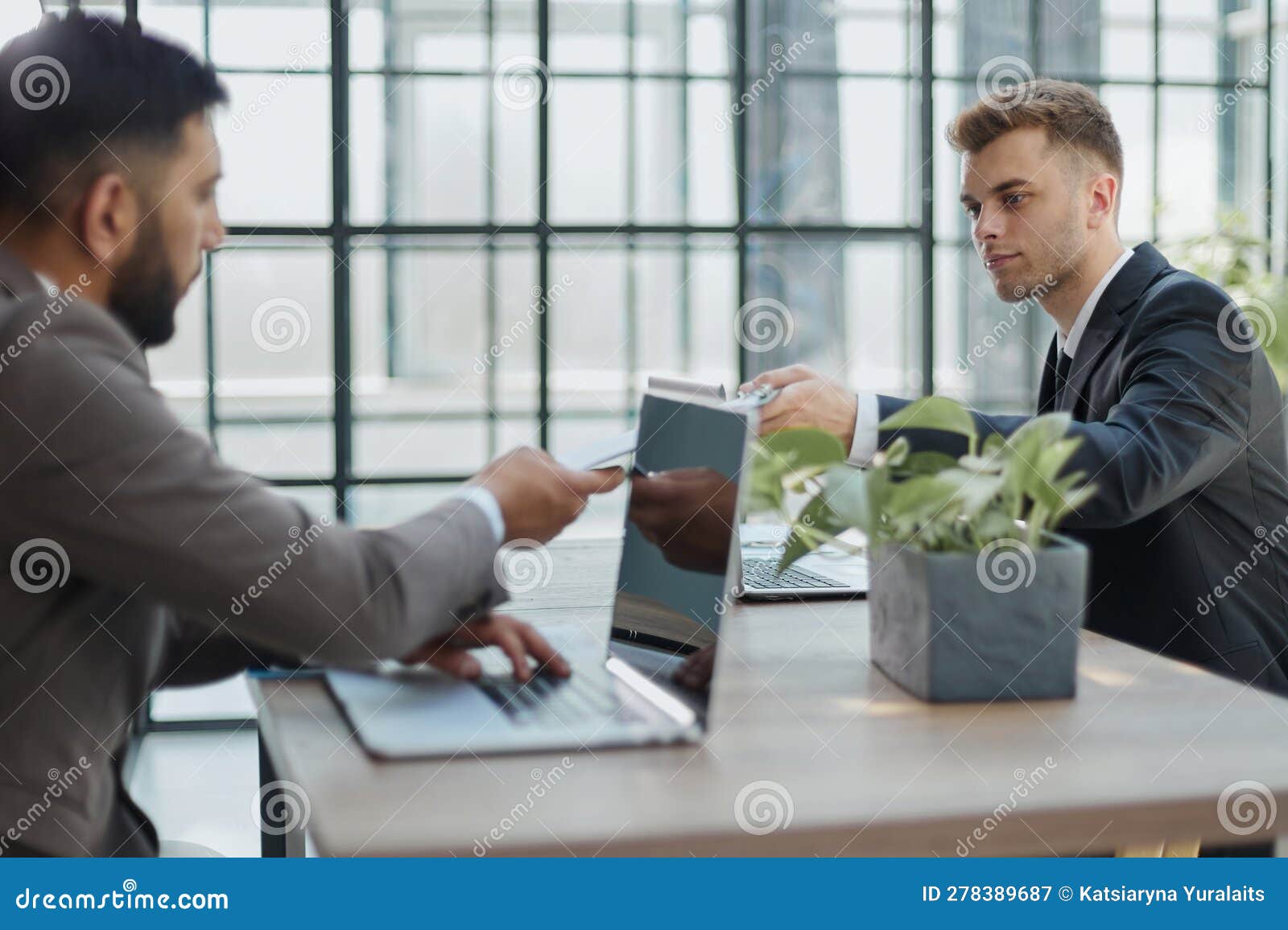 Two Happy Men Working Together on a New Business Project Stock Image ...