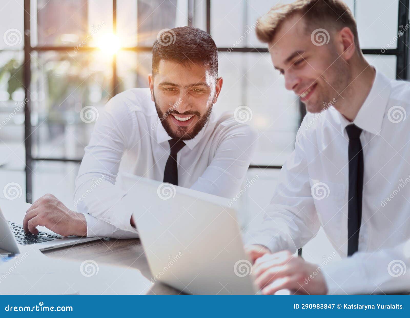 Two Happy Men Working Together on a New Business Project Stock Image ...