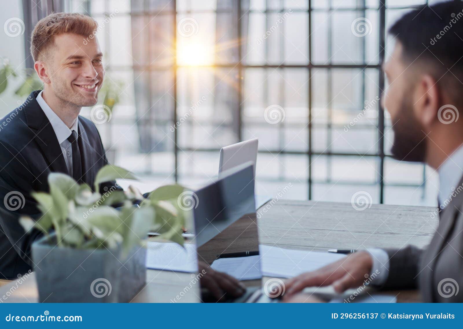 Two Happy Men Working Together on a New Business Project Stock Image ...