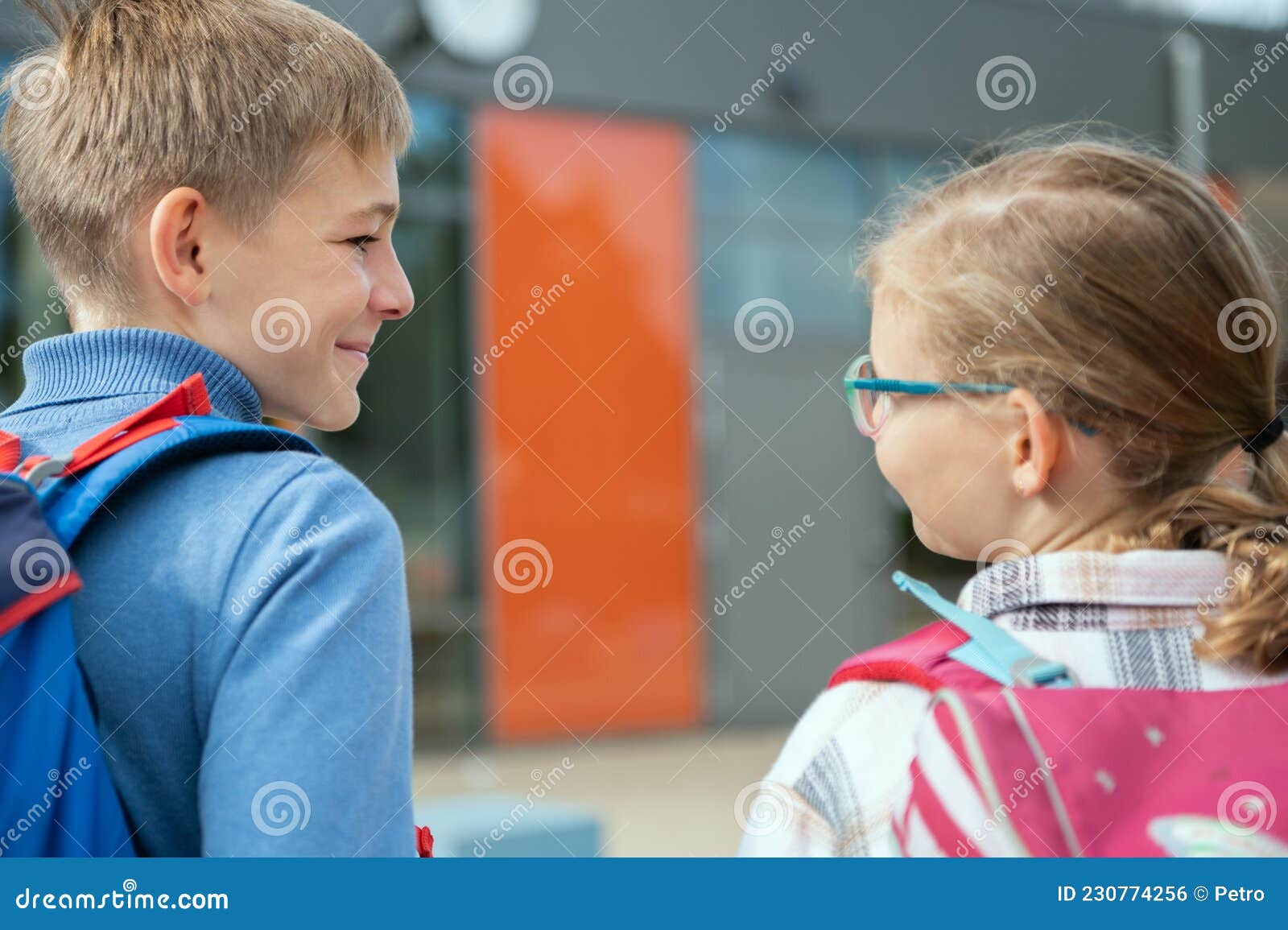 Two Happy School Children Walking and Talking in Campus before Lessons ...