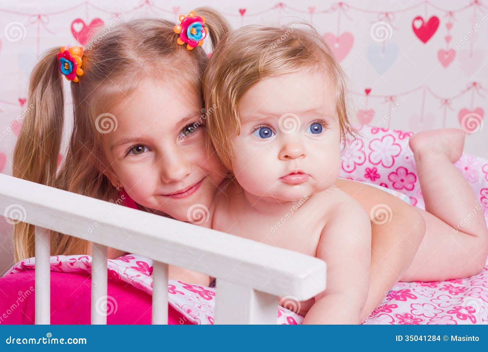 Two happy sisters hug stock photo. Image of people, small - 35041284