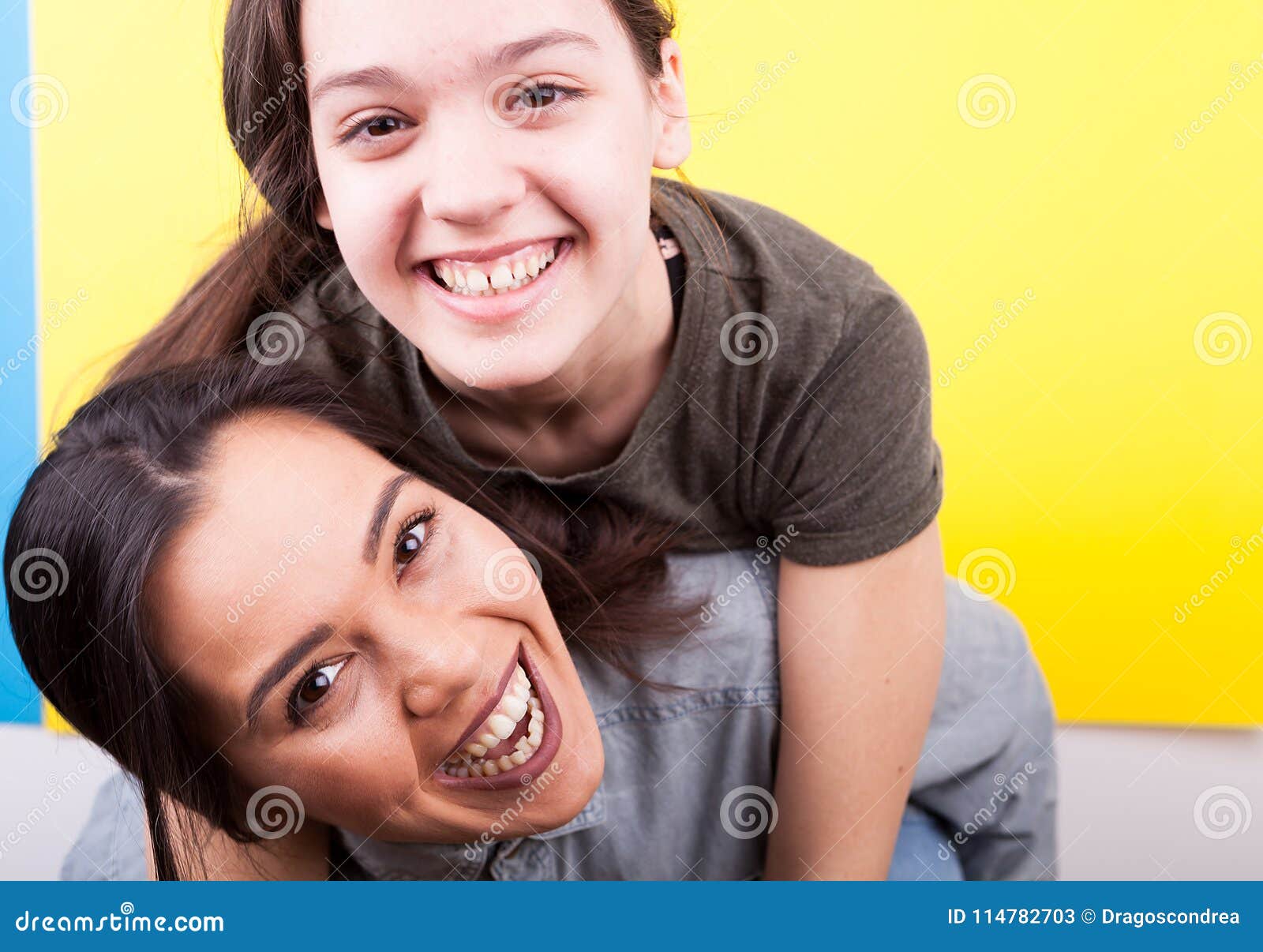 Two happy sisters laughing stock image. Image of outfit - 114782703