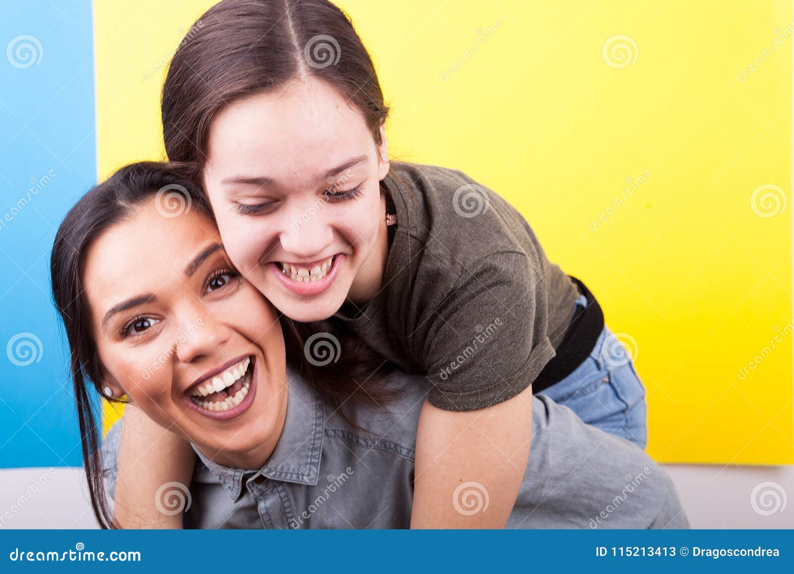 Two happy sisters laughing stock image. Image of friendship - 115213413