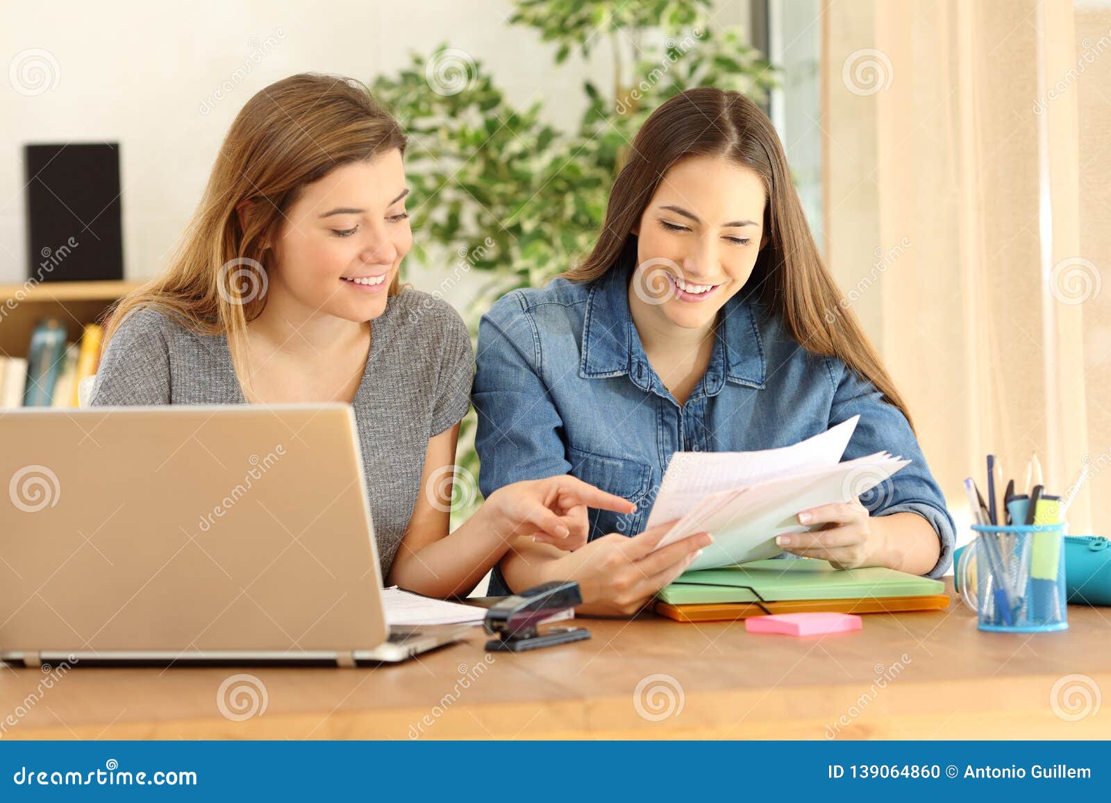 Happy Students Studying Checking Notes at Home Stock Photo - Image of ...