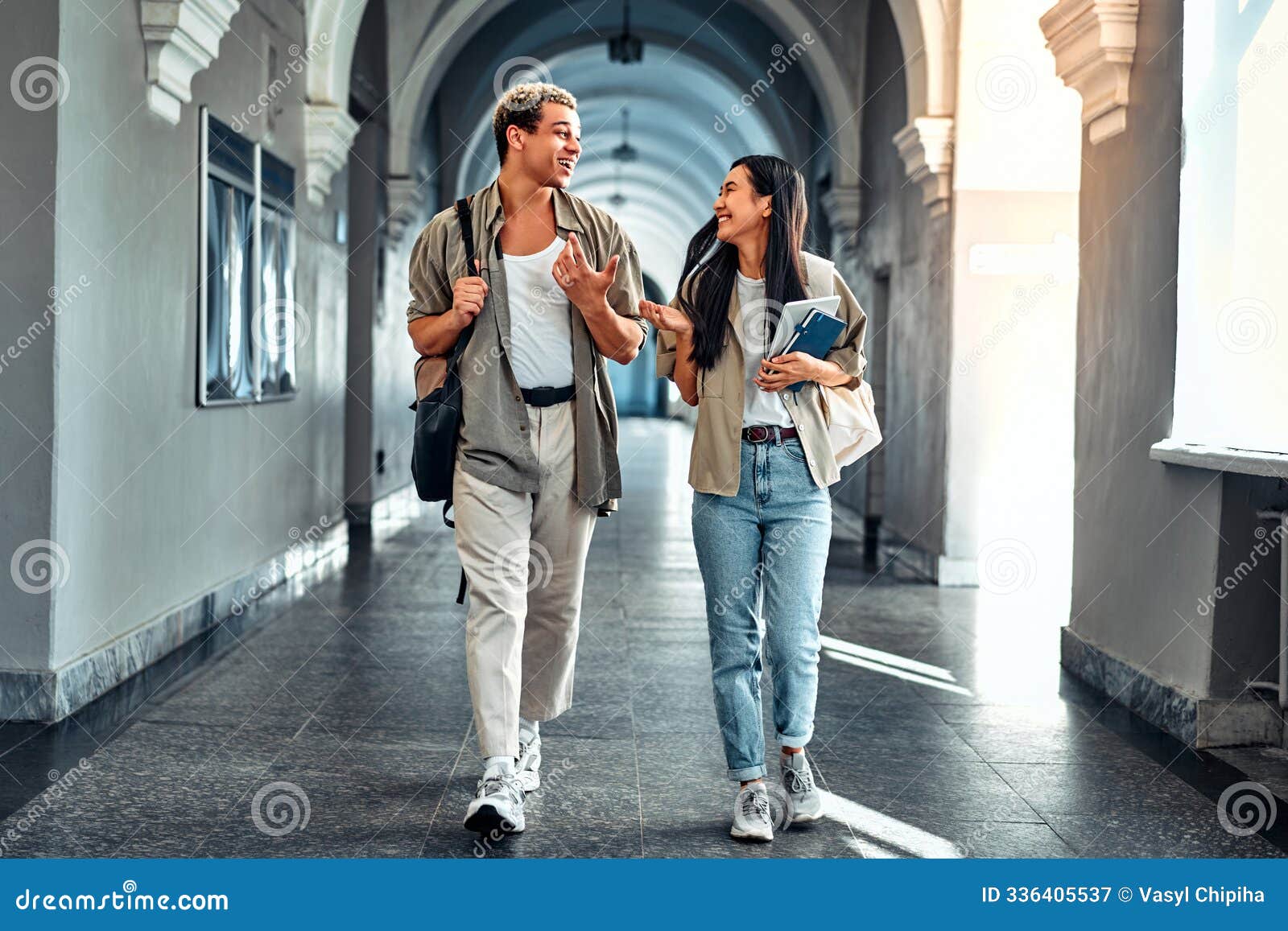 Two Happy Stylish Modern Students are Walking Down the University ...