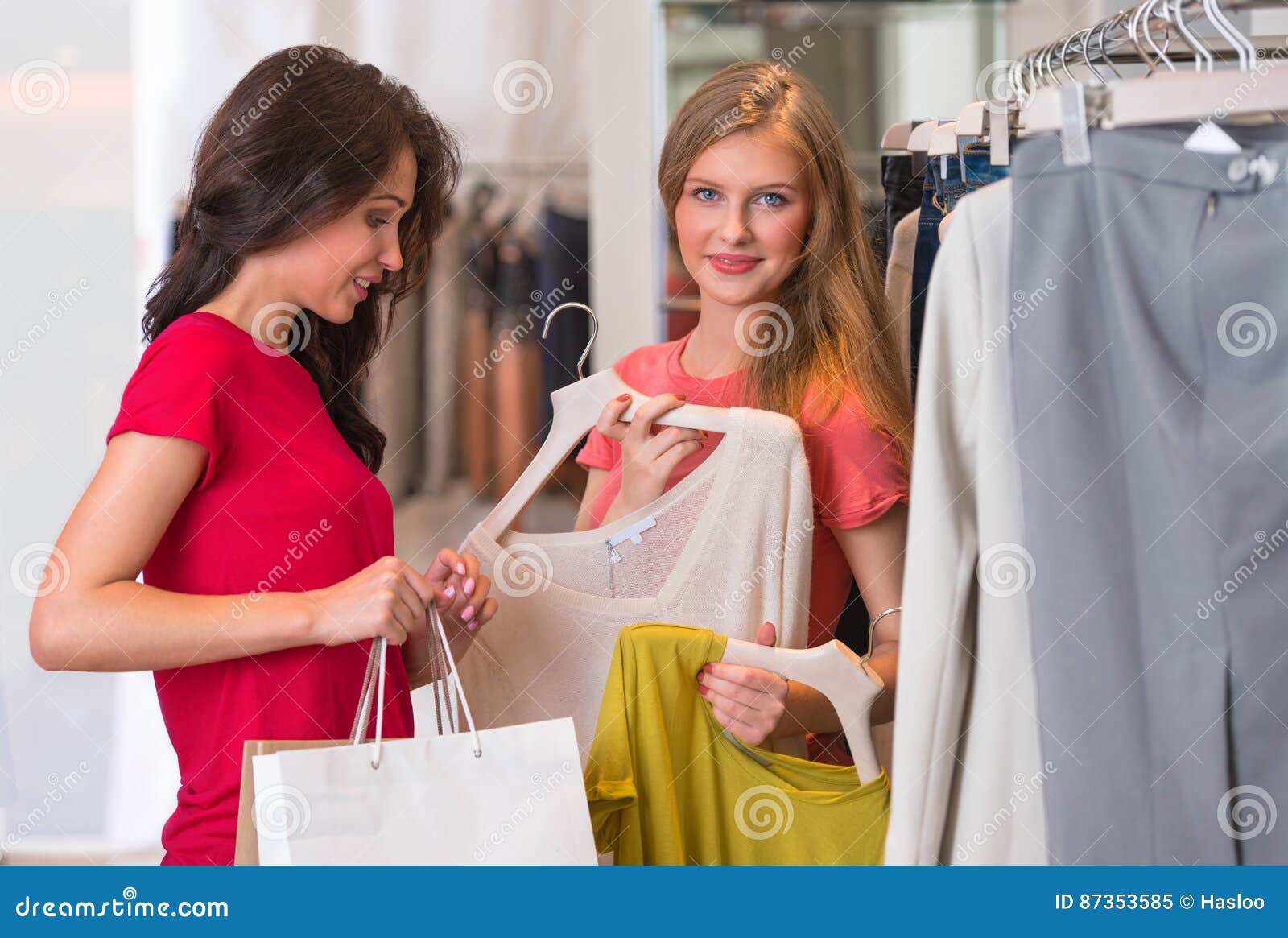 Two happy women shopping stock image. Image of glamour - 87353585