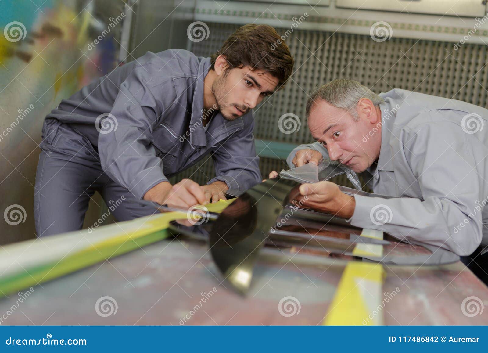 Two Happy Workmen Toiling at Locksmiths Workshop Stock Photo - Image of ...