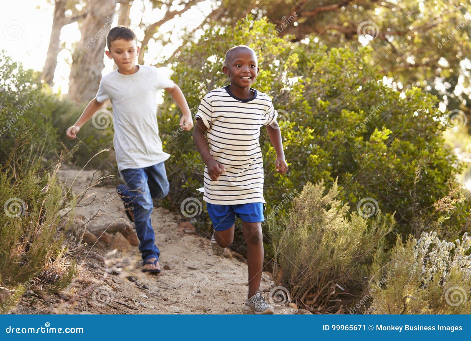 Two Happy Young Boys Running Down a Forest Path Stock Image - Image of ...