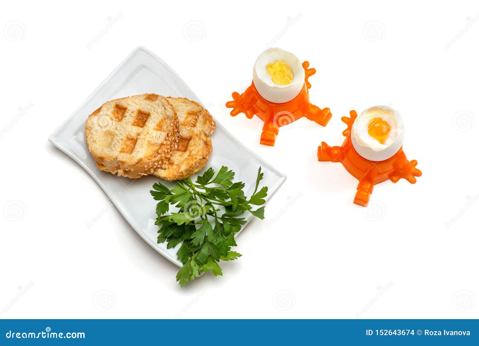 A Two of Hard-boiled and Soft-boiled Eggs Stand in Egg Cups, Next To it ...