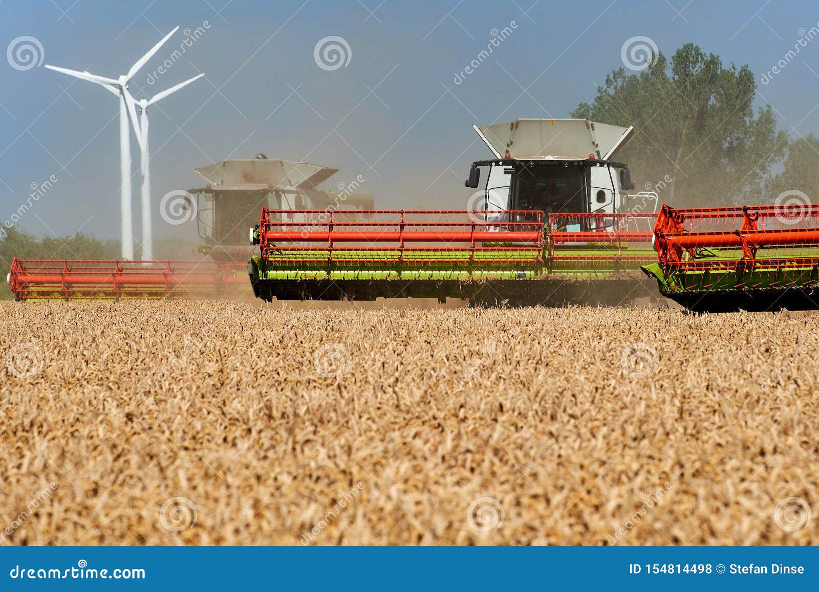 Two Harvester Unloading Corn on Tractor Stock Photo - Image of rural ...