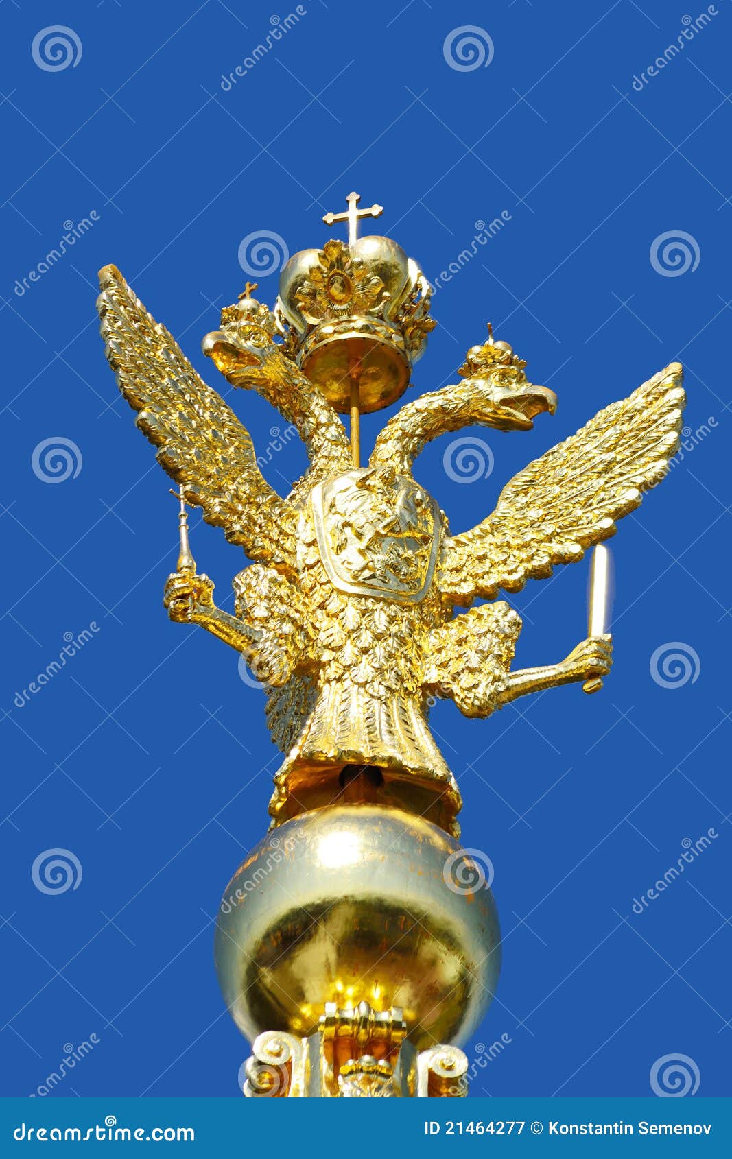 Two-headed Golden Eagle On The Background Of The Blue Sky-a Spire On ...