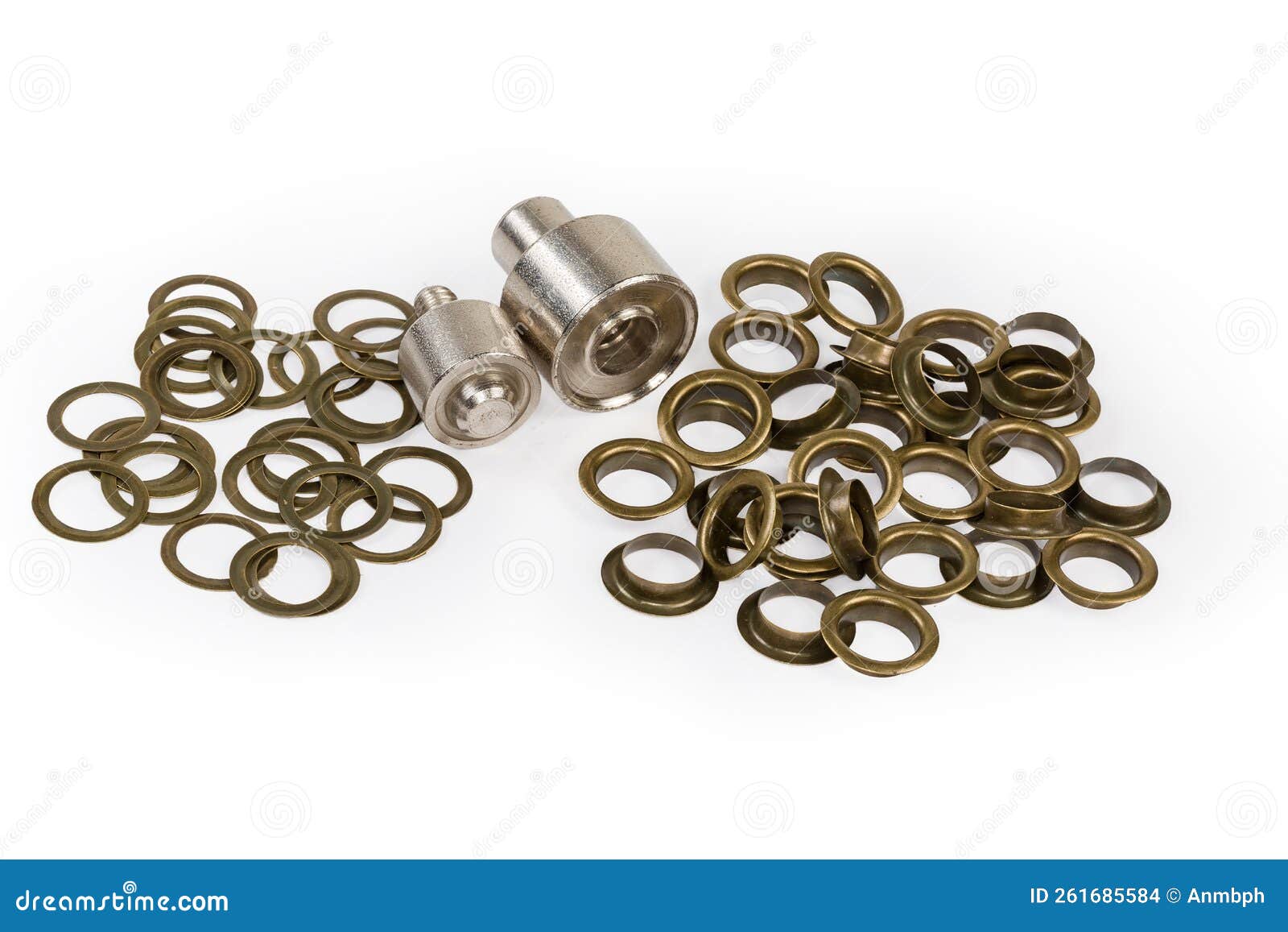 Two Heaps of Metal Eyelets Components and Setting Tool Stock Photo ...