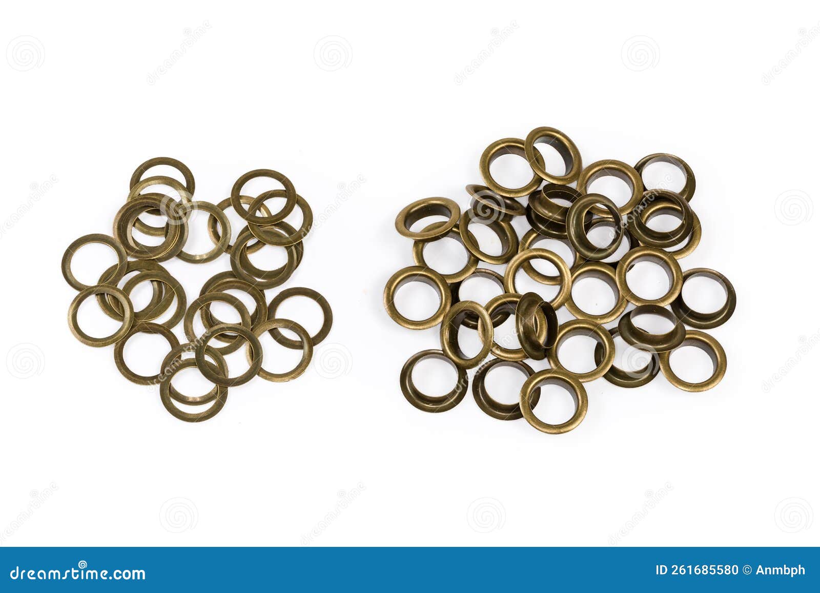 Two Heaps of Metal Eyelets Components on a White Background Stock Photo ...