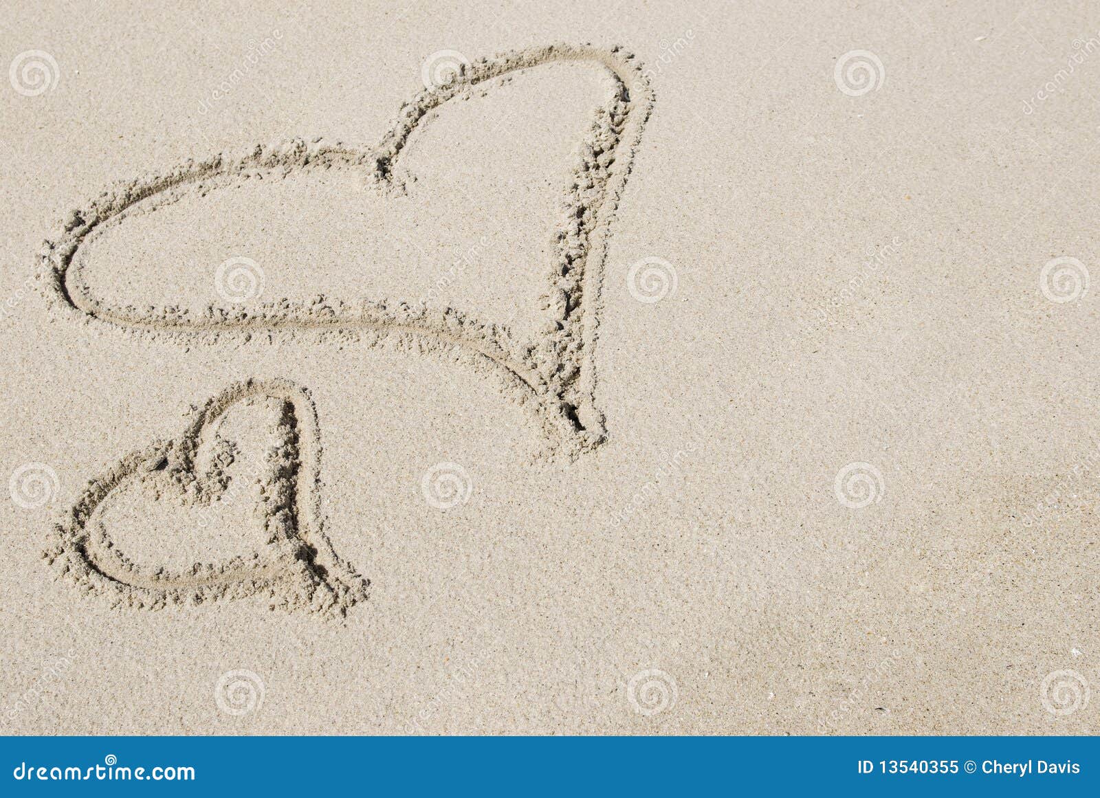 Two Hearts Drawn in Sand stock image. Image of shore - 13540355