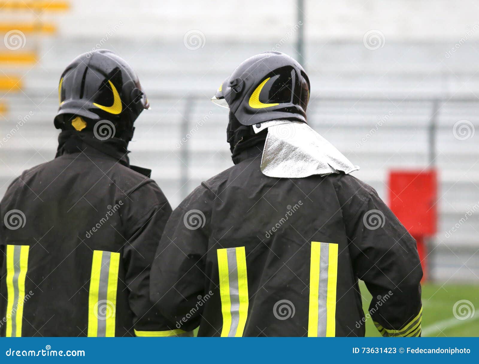 Two Helmeted Fire Brigade in the Stadium Stock Image - Image of safety ...
