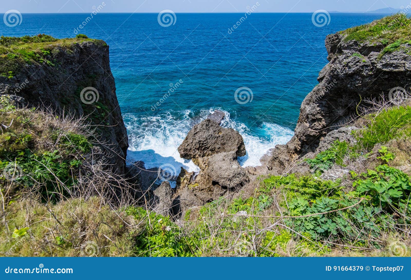 Two High Cliffs Above Big Wave Stock Image - Image of high, stone: 91664379
