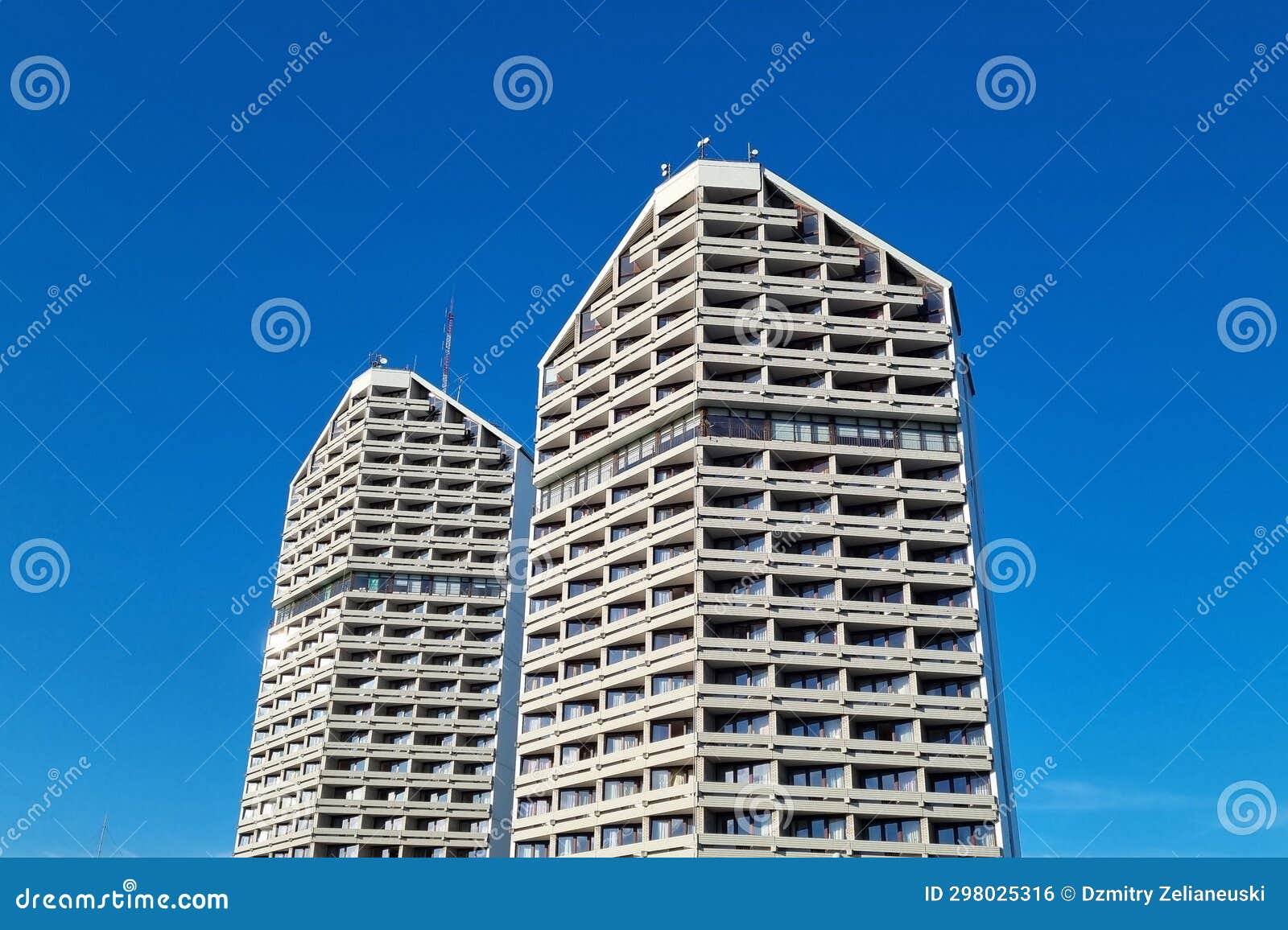 Two High-rise Buildings Against the Blue Sky. Stock Photo - Image of ...