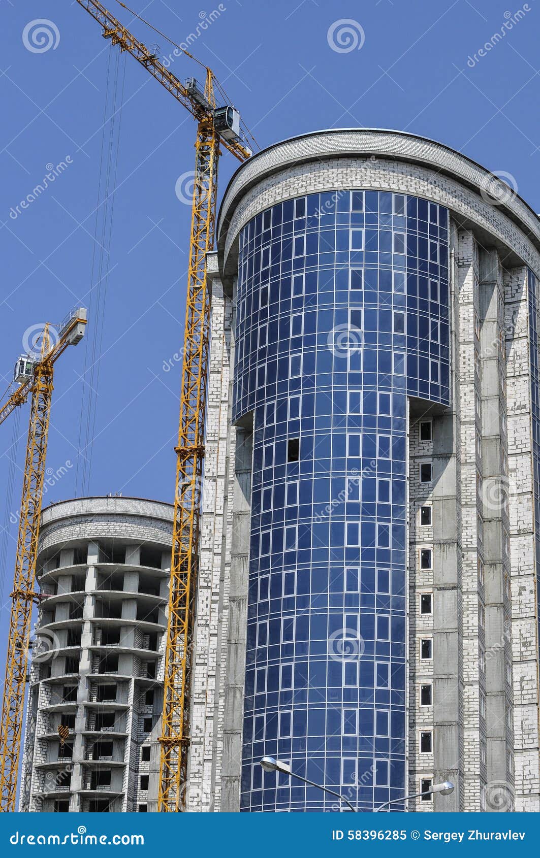 Two High-rise Buildings Under Construction and Cranes Stock Image ...