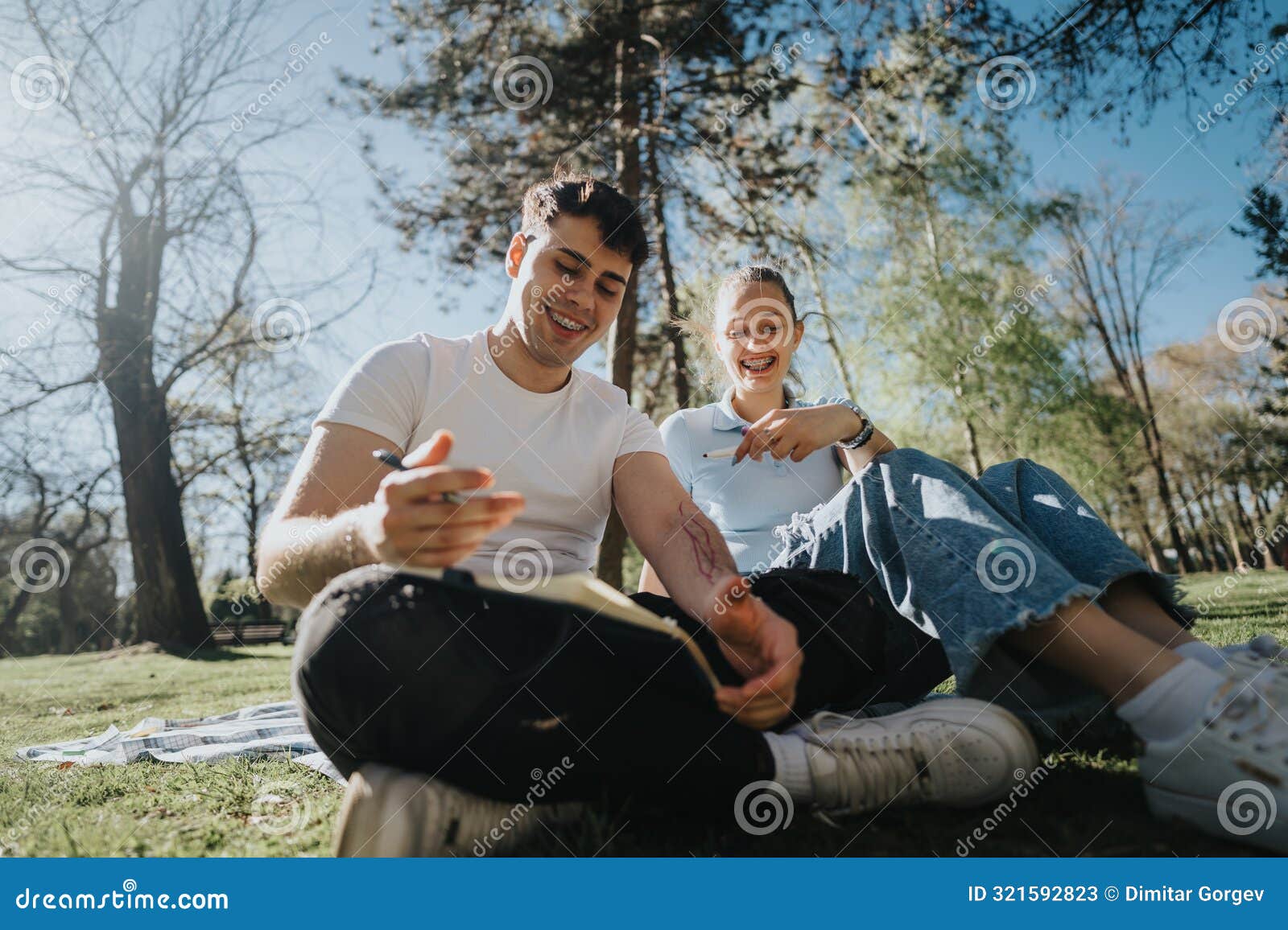High School Students Studying Together Outdoors on a Sunny Day ...