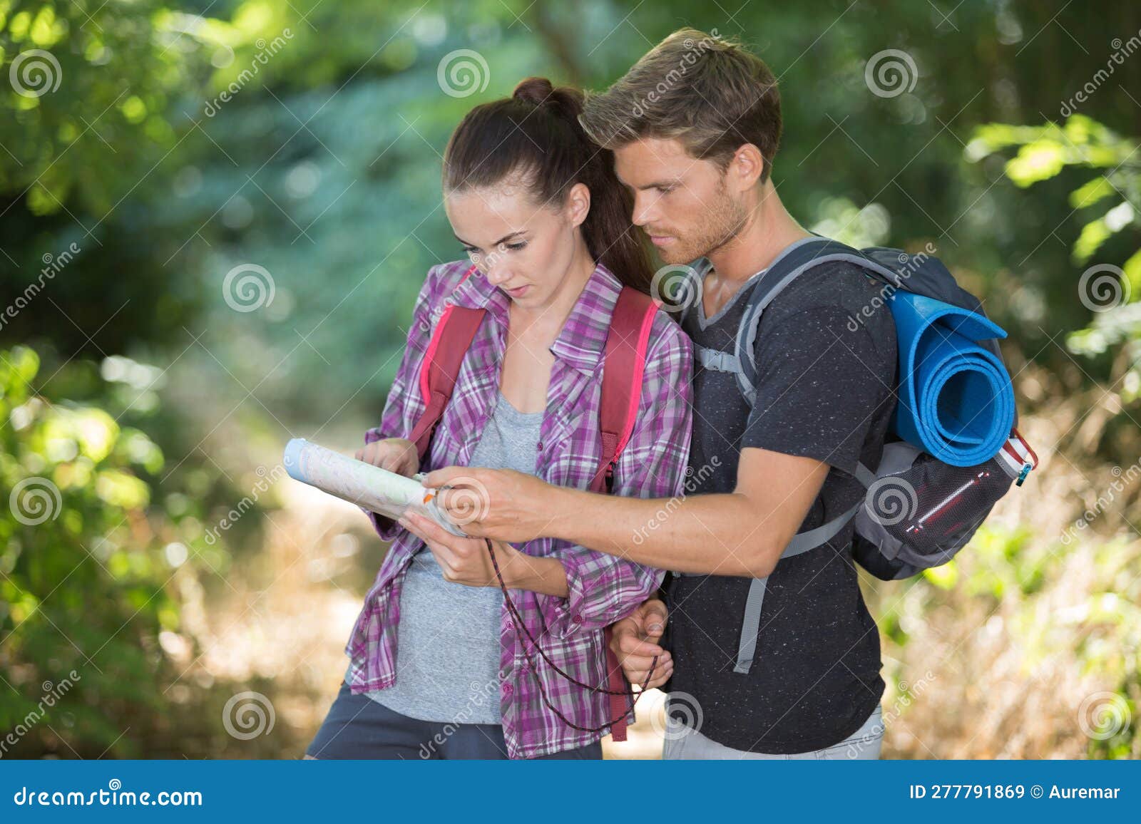 Two hiker checking map stock image. Image of navigational - 277791869