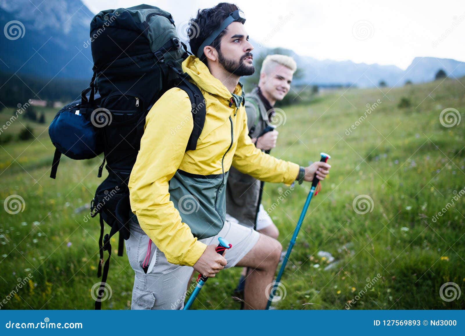 Two Hikers Out Trekking in the Mountains Stock Image - Image of outside ...