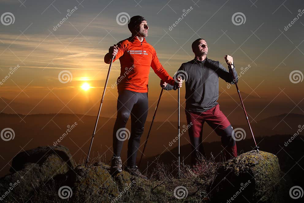 Two Hikers on the Top of the Hill Stock Photo - Image of beautiful ...