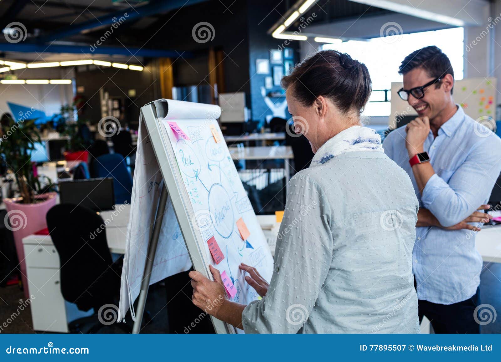 Two Hipsters Working a on a Board Stock Image - Image of asian ...