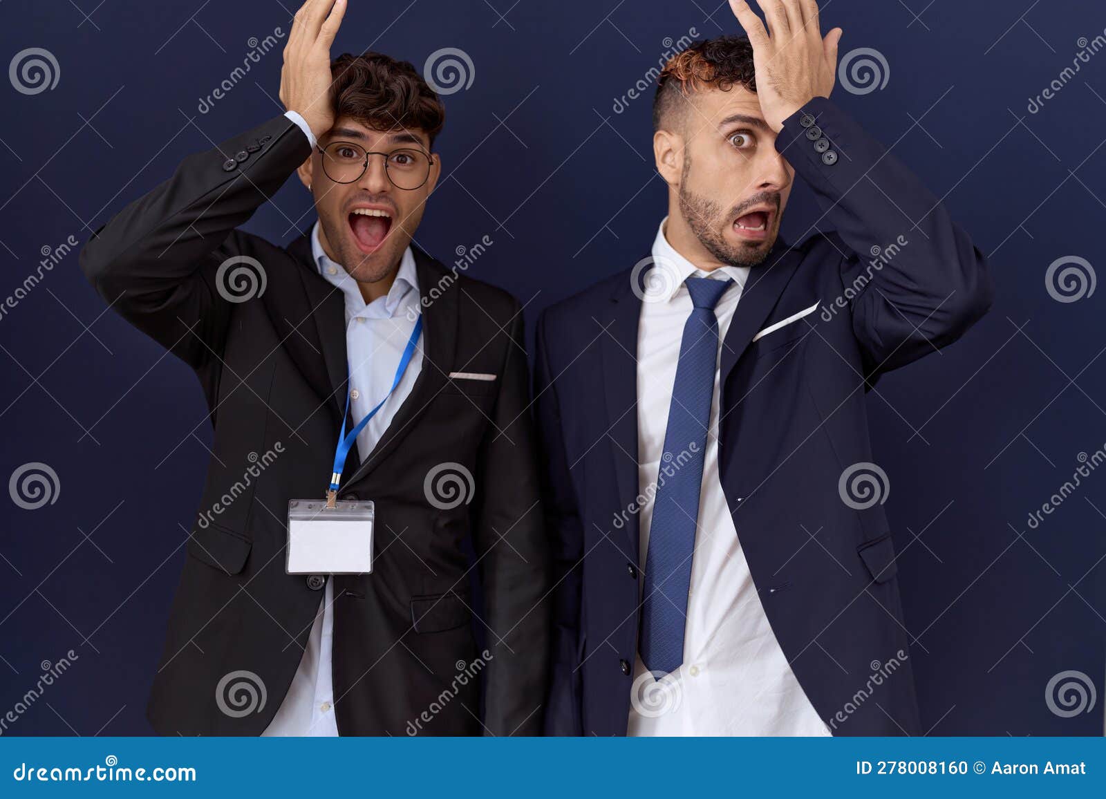 Two Hispanic Business Men Wearing Business Clothes Surprised with Hand ...