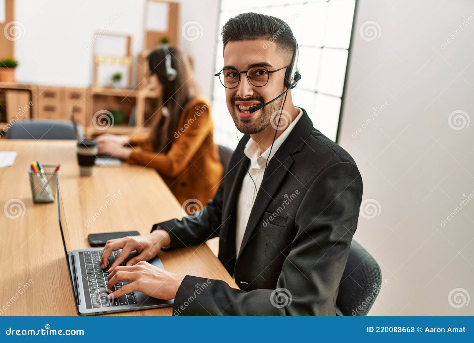 Two Hispanic Call Center Agents Working at the Office Stock Photo ...