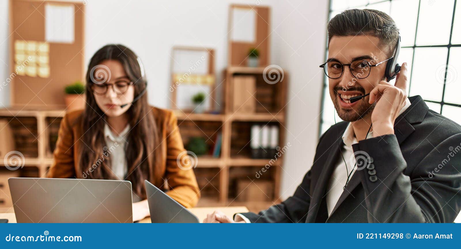 Two Hispanic Call Center Agents Working at the Office Stock Photo ...