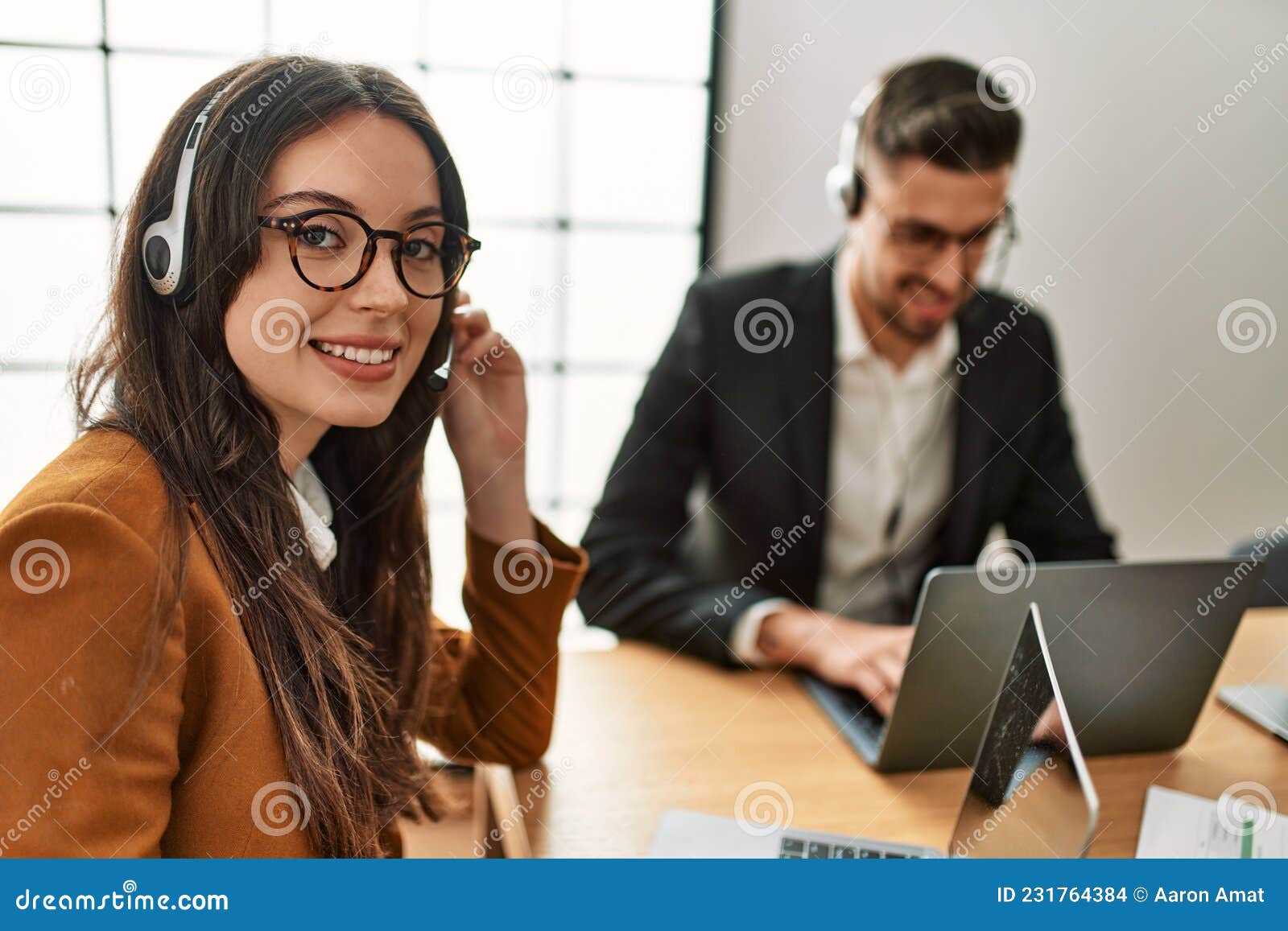 Two Hispanic Call Center Agents Working at the Office Stock Photo ...