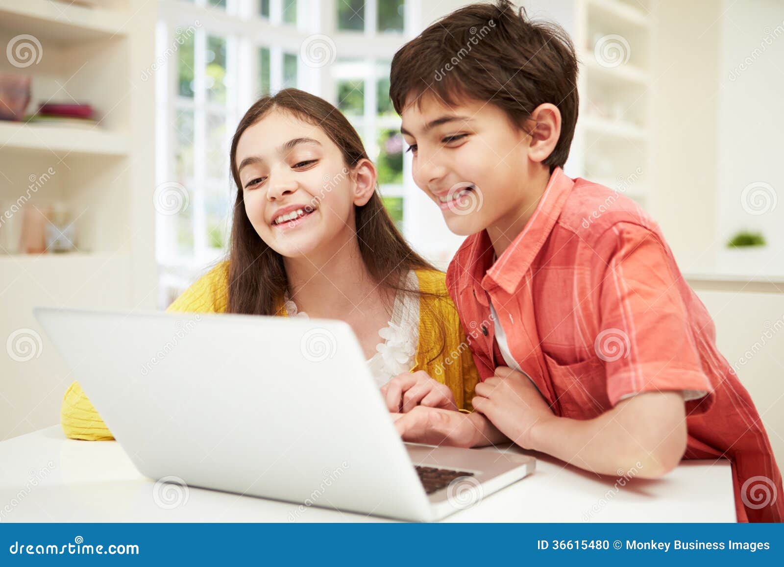 Two Hispanic Children Looking at Laptop Stock Photo - Image of sibling ...