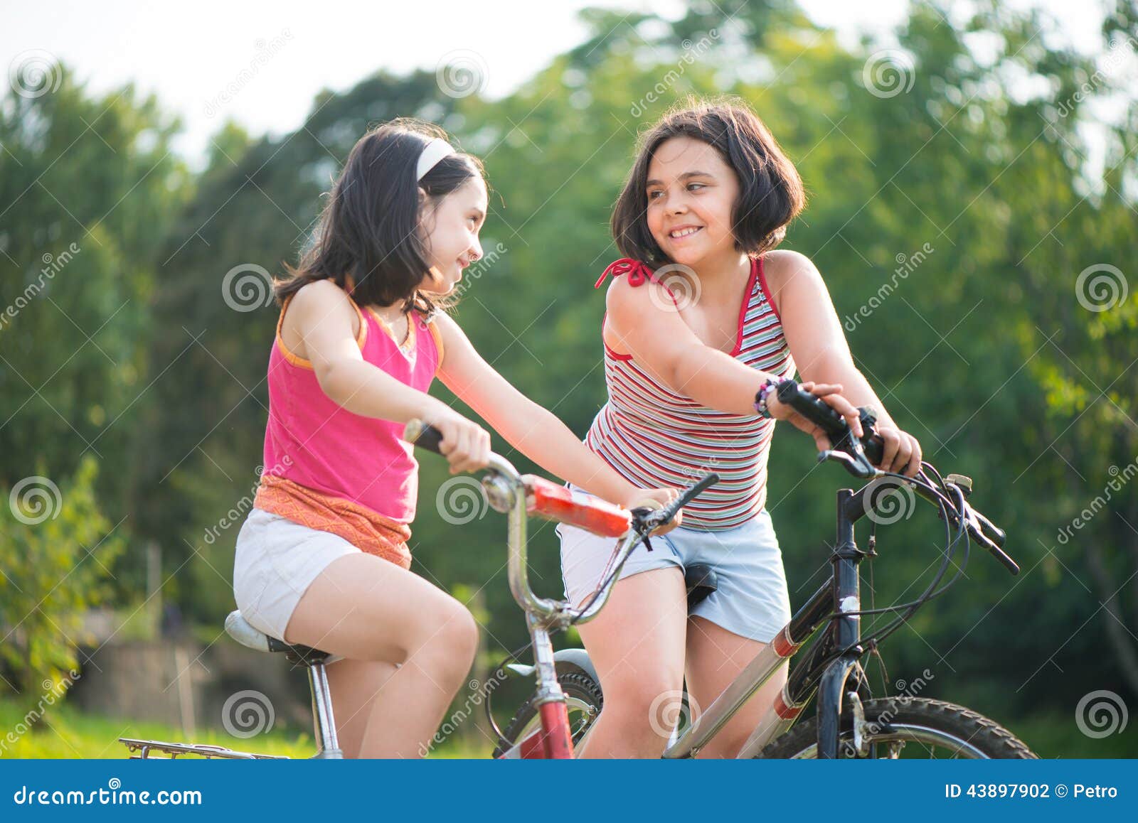 Two Hispanic Children Riding on Bikes Stock Photo - Image of hispanic ...