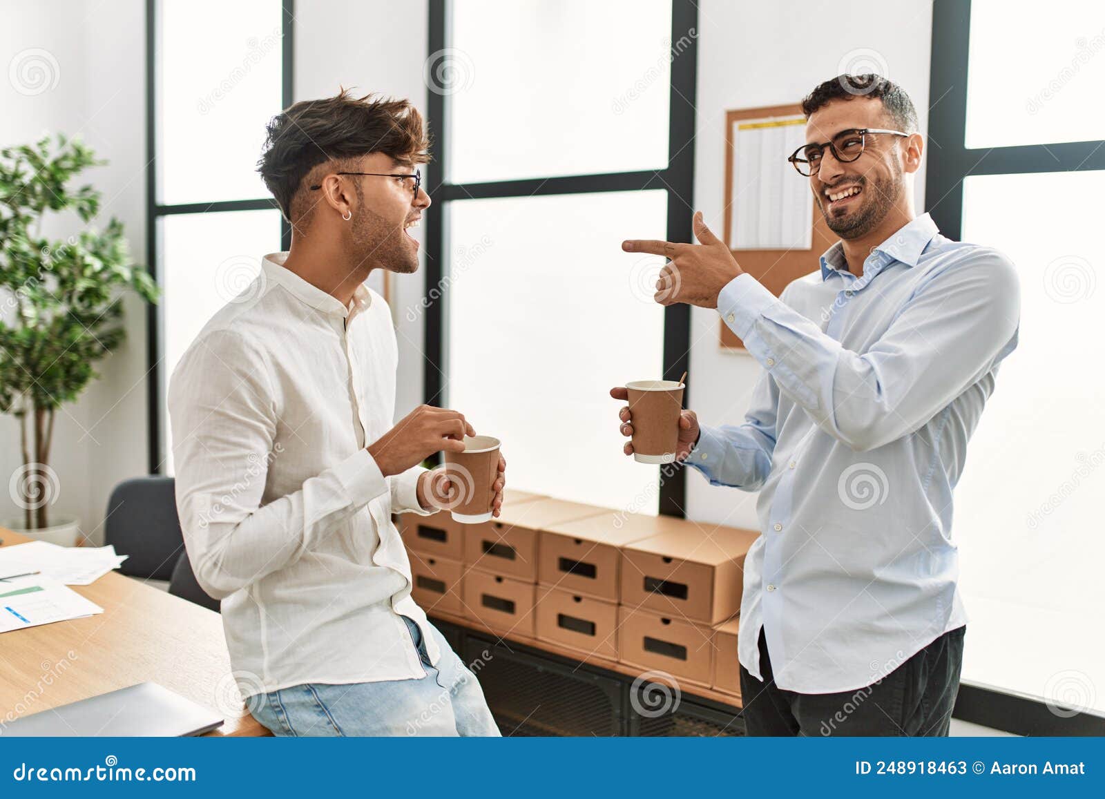 Two Hispanic Men Business Workers Drinking Coffee Working at Office ...
