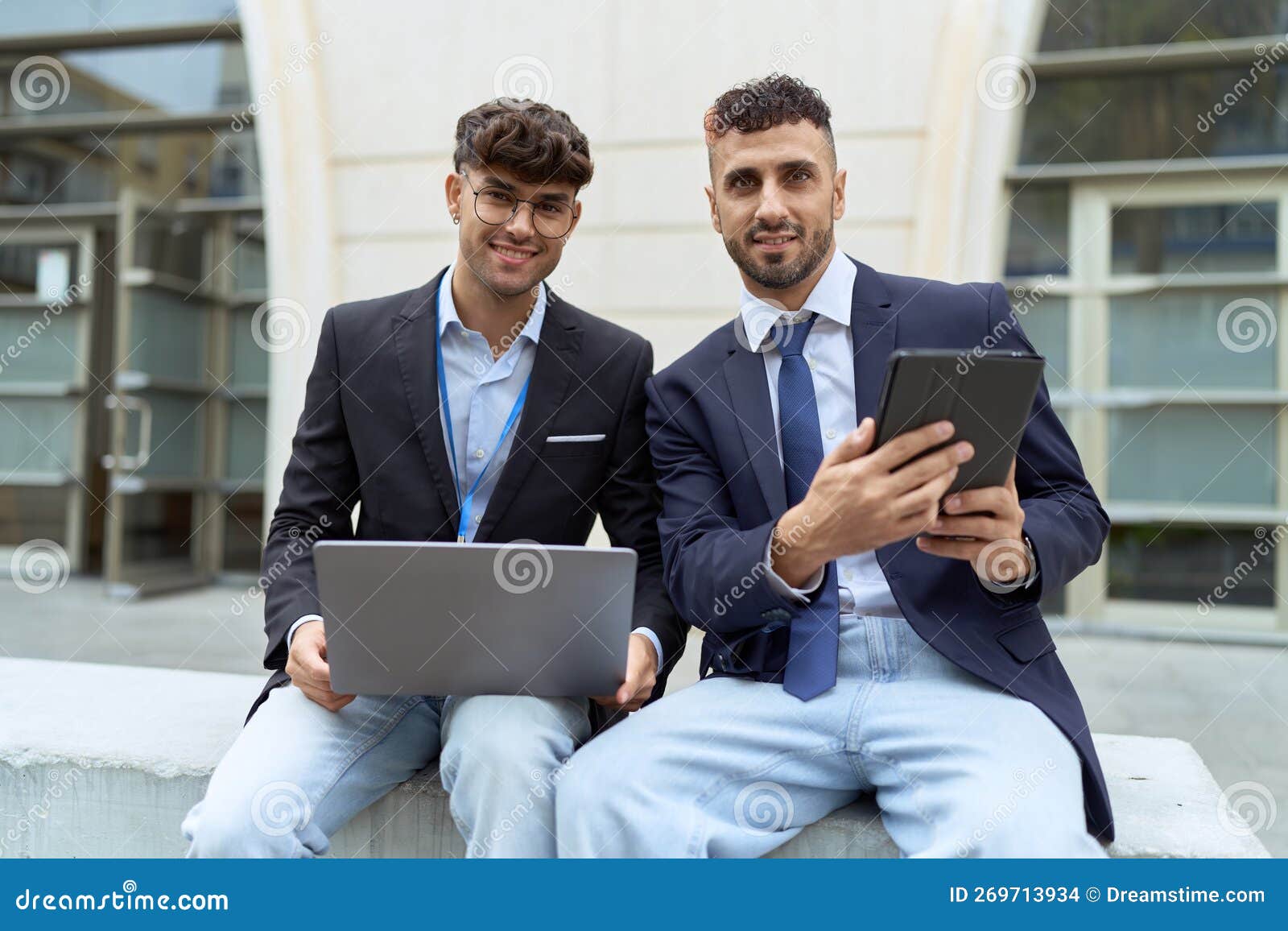 Two Hispanic Men Business Workers Using Touchpad and Laptop Working at ...