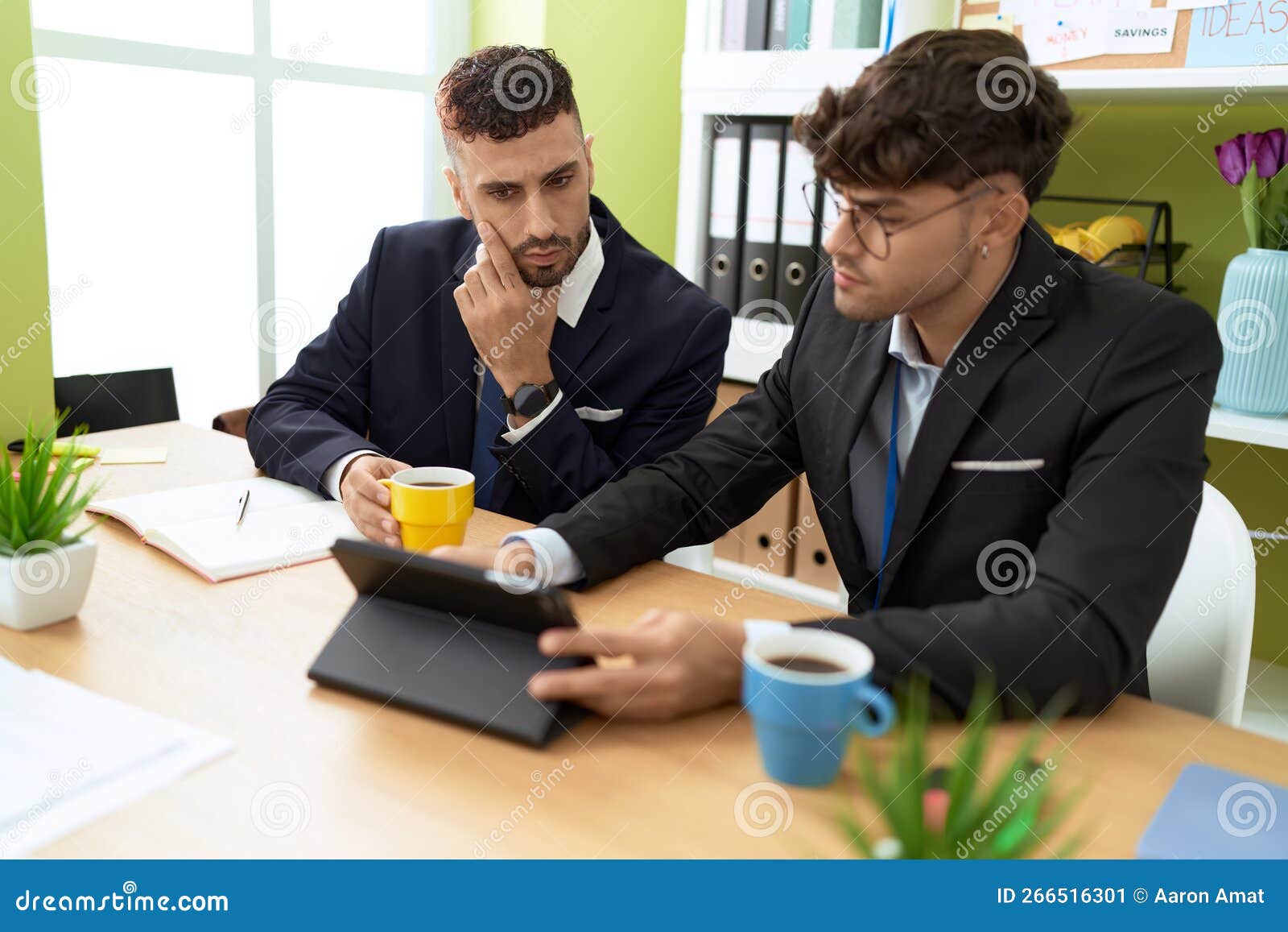 Two Hispanic Men Business Workers Using Touchpad Working at Office ...