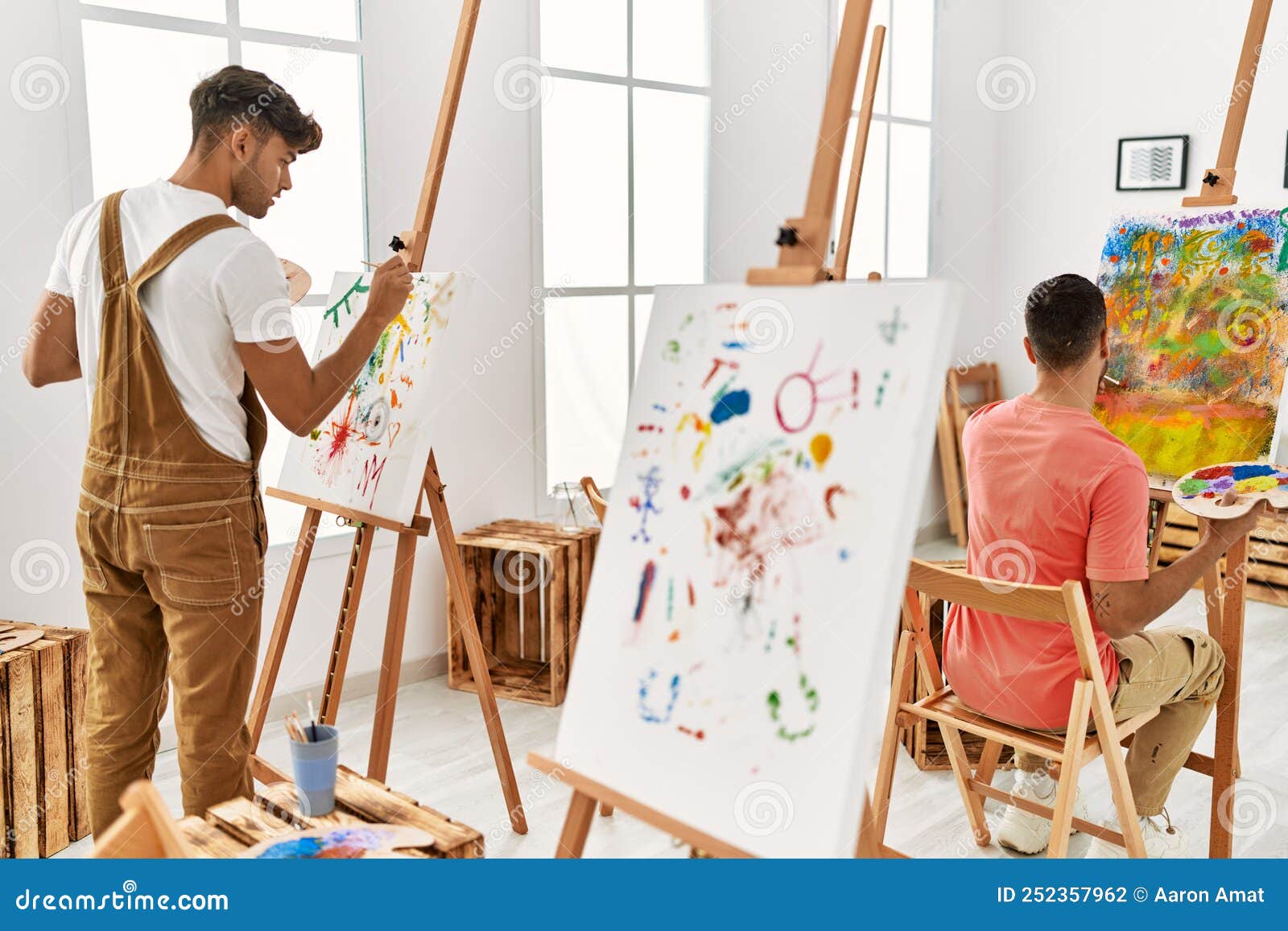 Two Hispanic Men Couple Drawing at Art Studio Stock Photo - Image of ...
