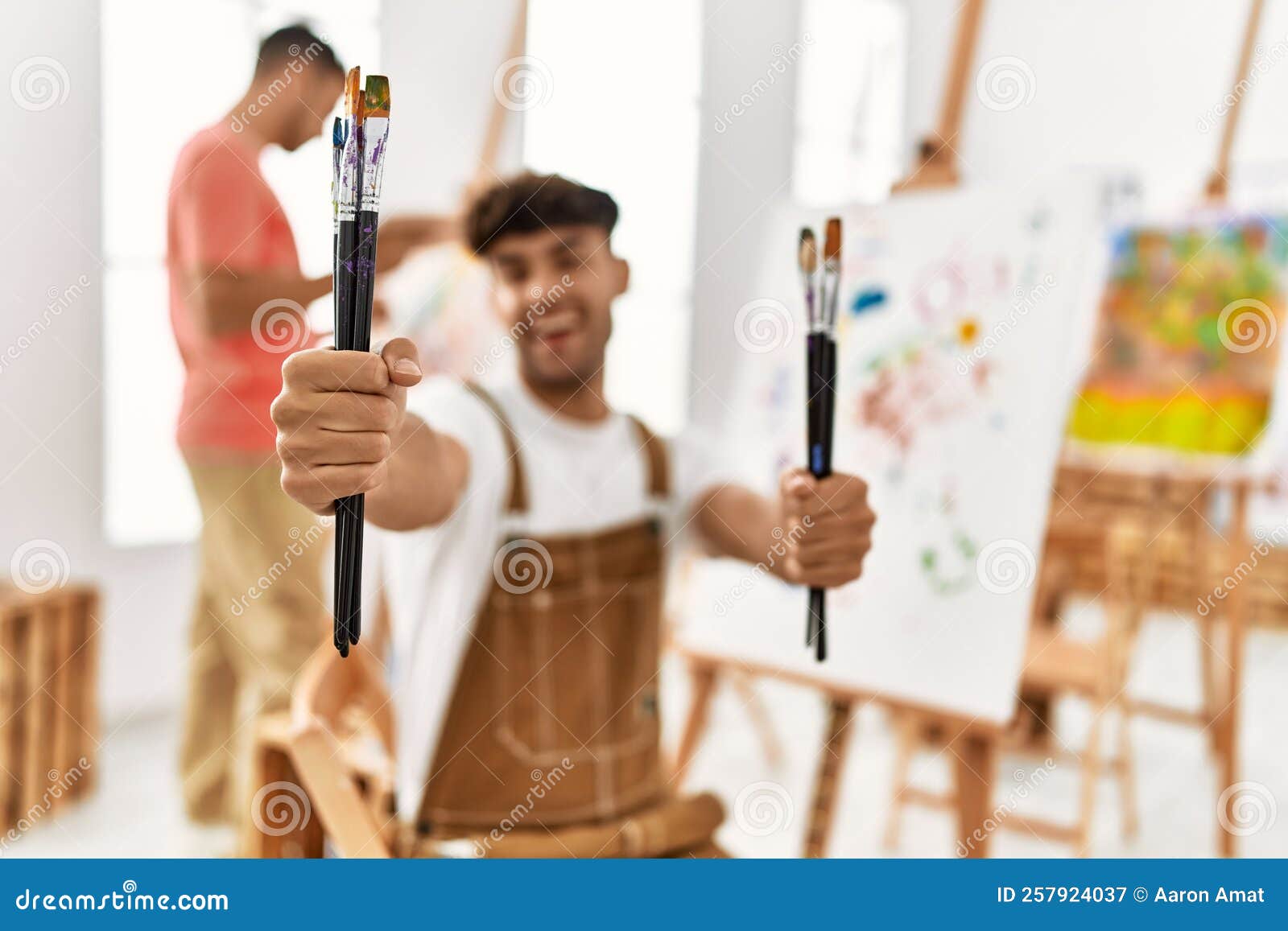Two Hispanic Men Couple Smiling Confident Drawing at Art Studio Stock ...
